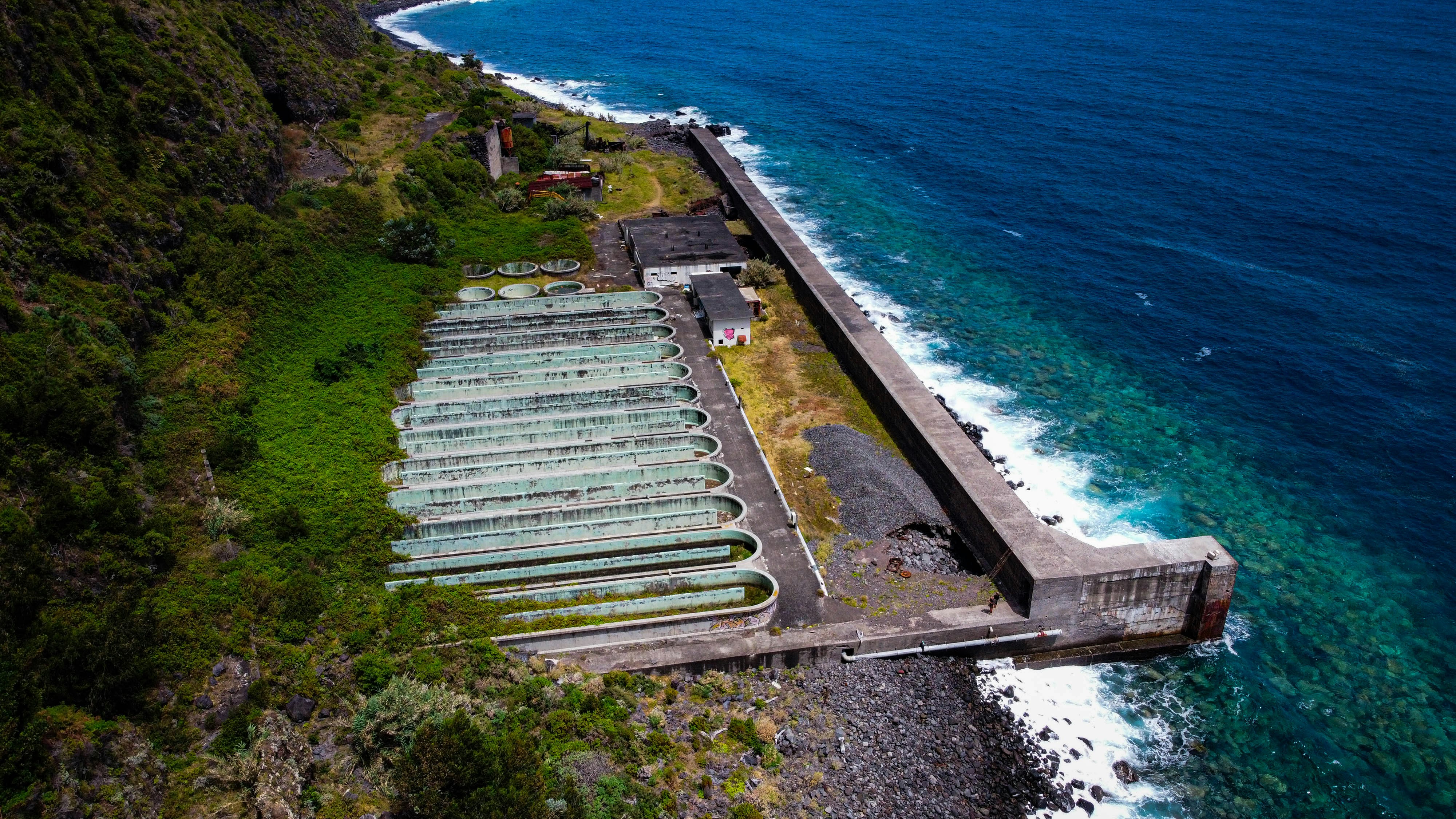 Sea Wall Terraces: Abandoned Coastal Retreat Clinging to the Cliff