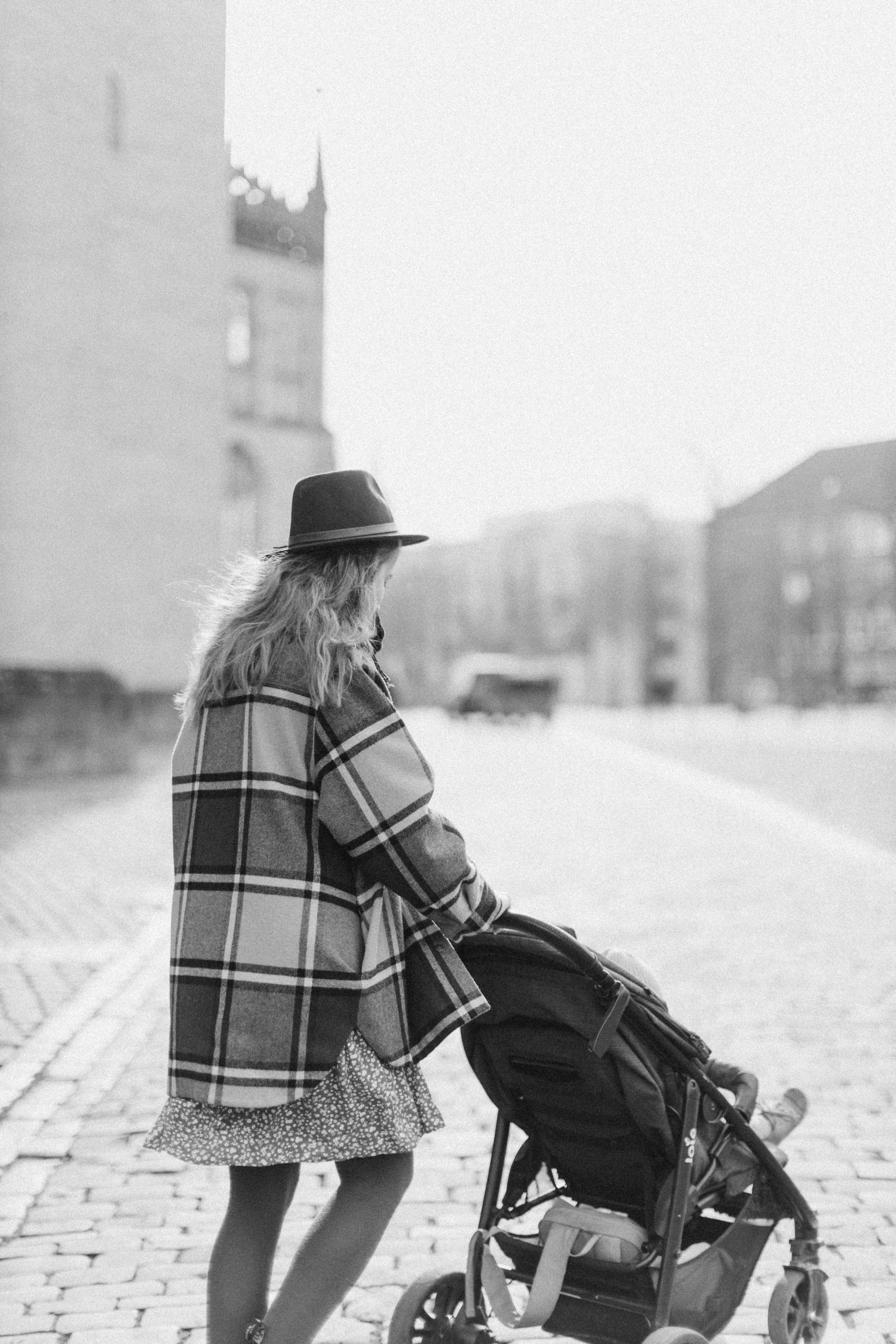 Plaid Quiet: A Street Portrait of a Woman and a Stroller