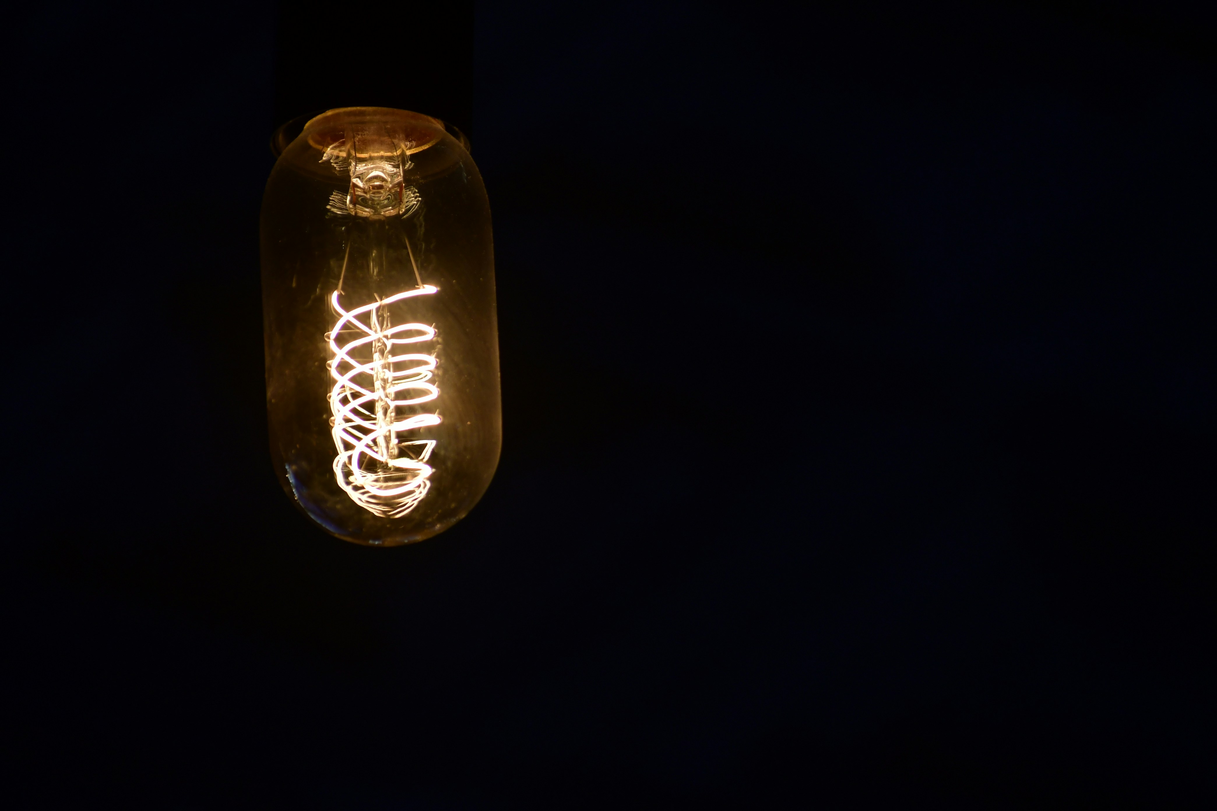 A light bulb with a string wrapped around it photo – Free Light Image ...