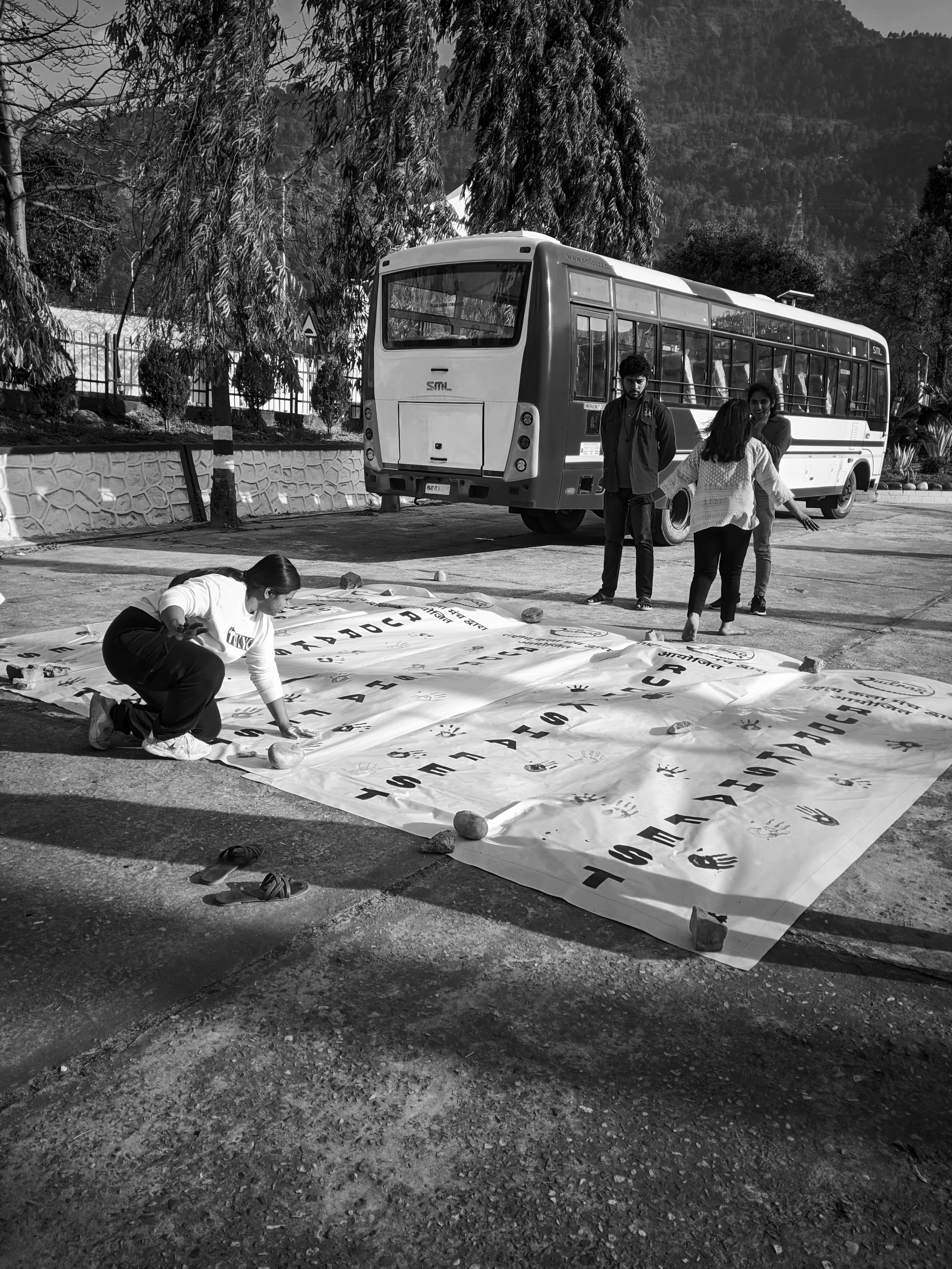 Community Banner Unfolding by the Bus Stop