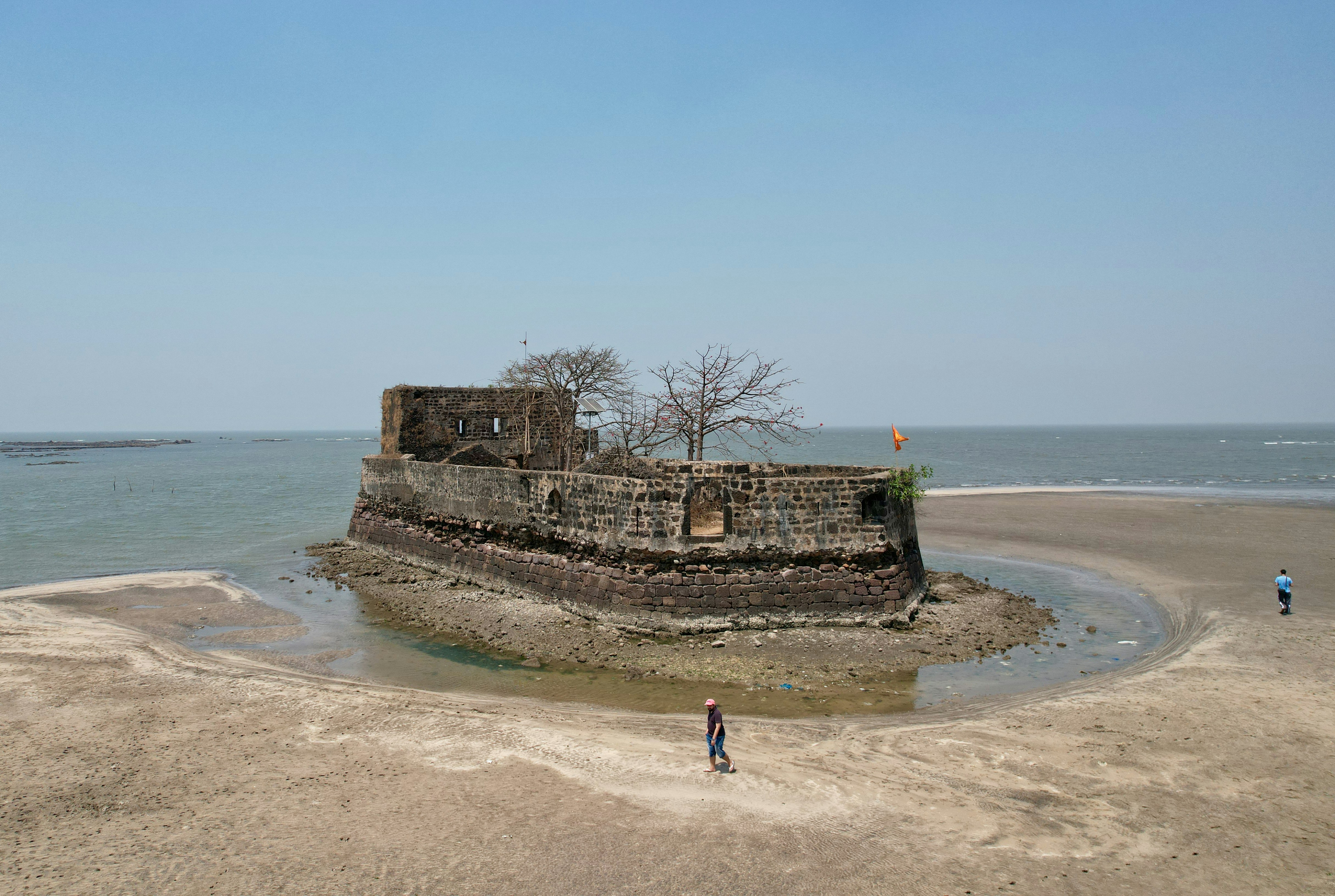 Ringed Fort on a Quiet Shore: A Round Bastion Amid Tidal Sands