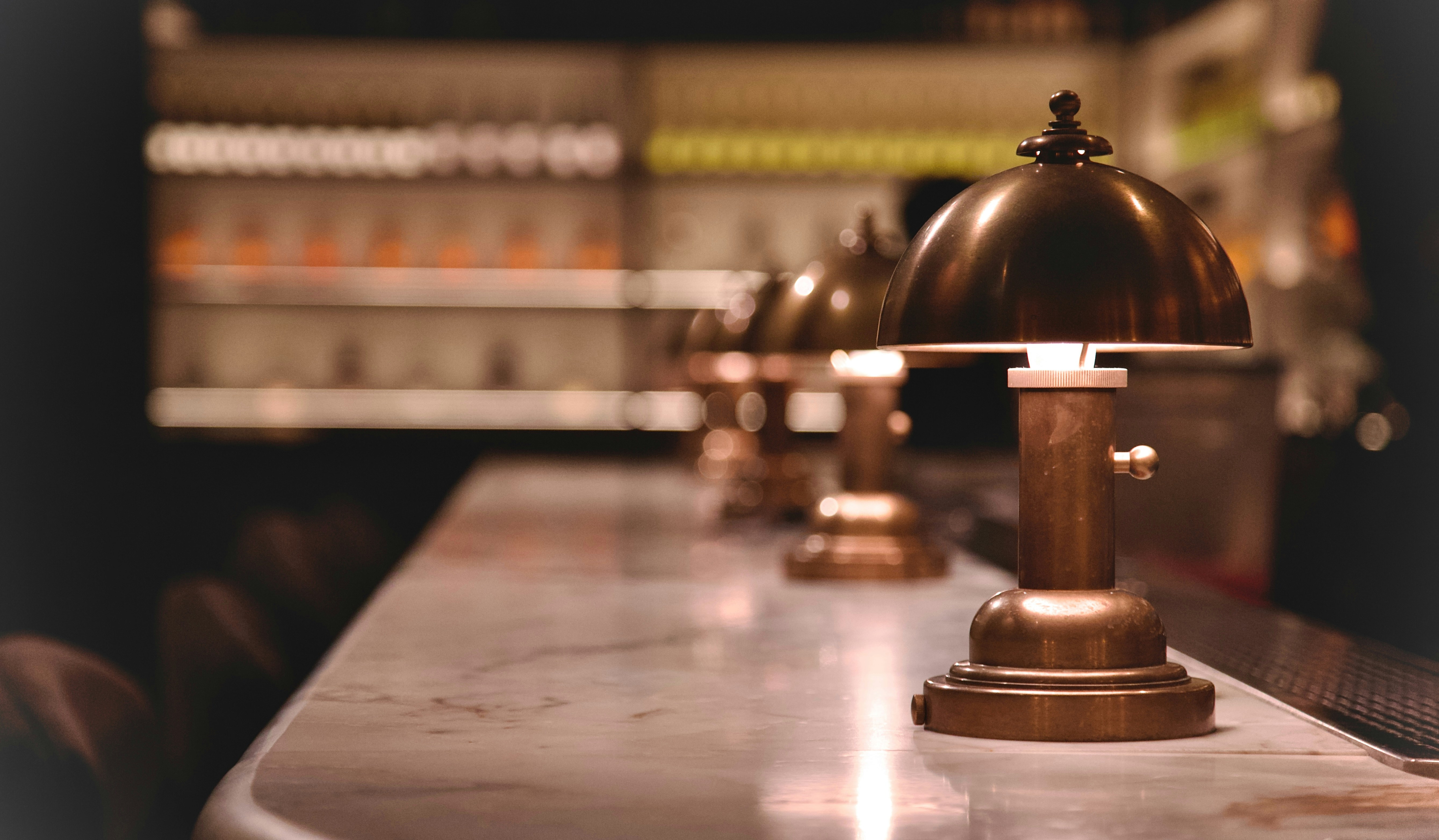 Amber Dome Over Marble Bar: Quiet Glow in a Dim Café