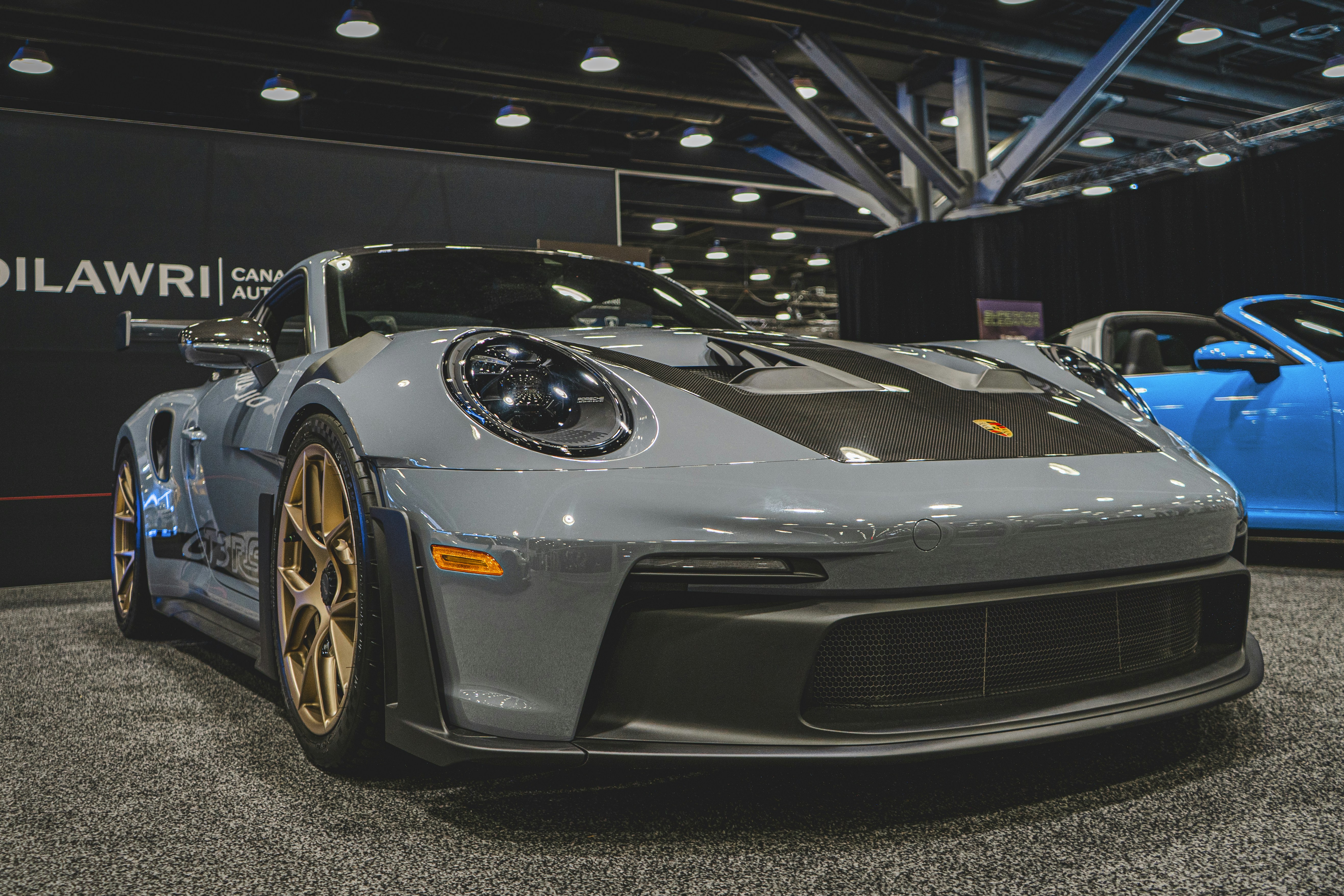 A grey sports car on display at a car show photo – Free Canada Image on ...