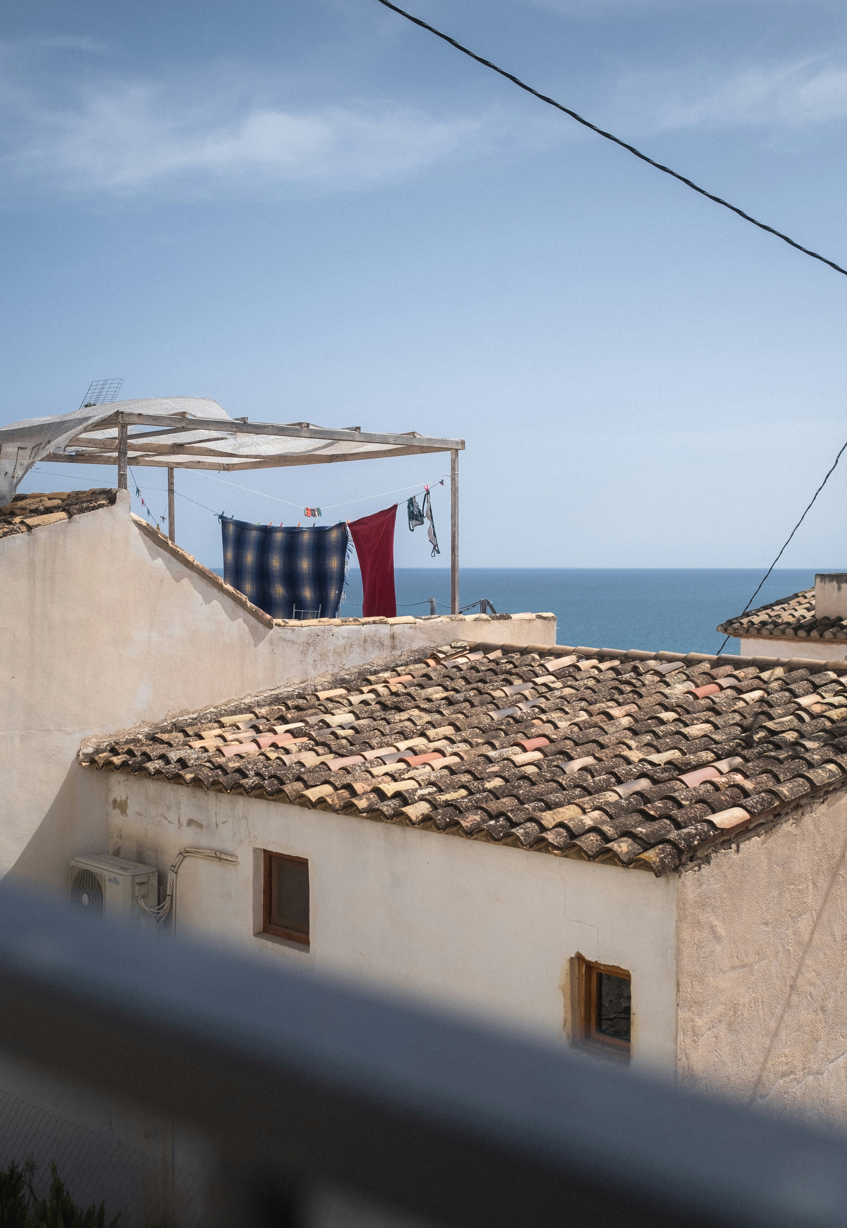 Laundry Lines Over a Mediterranean Rooftop Sea View