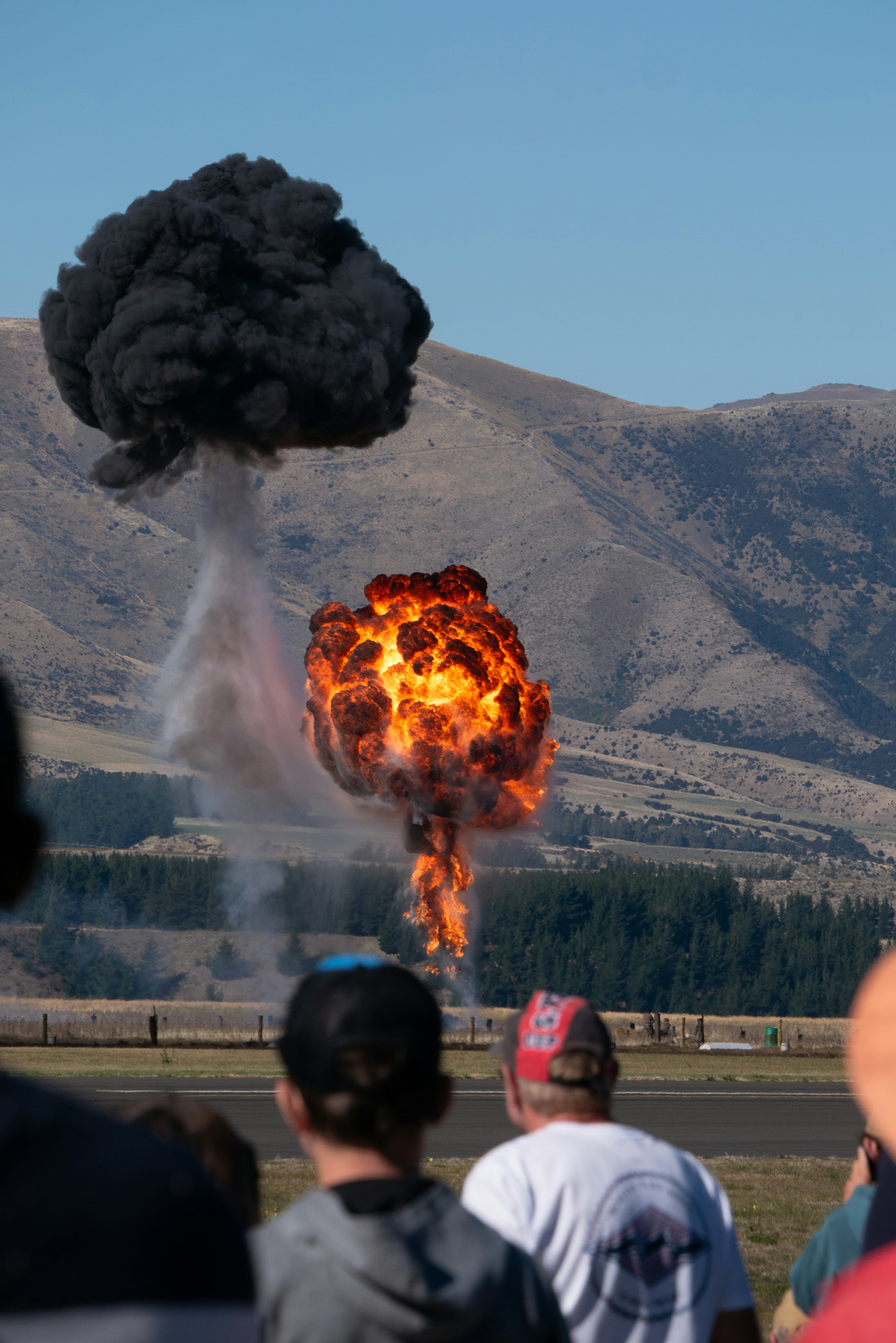 A group of people watching a large explosion photo – Free New zealand ...