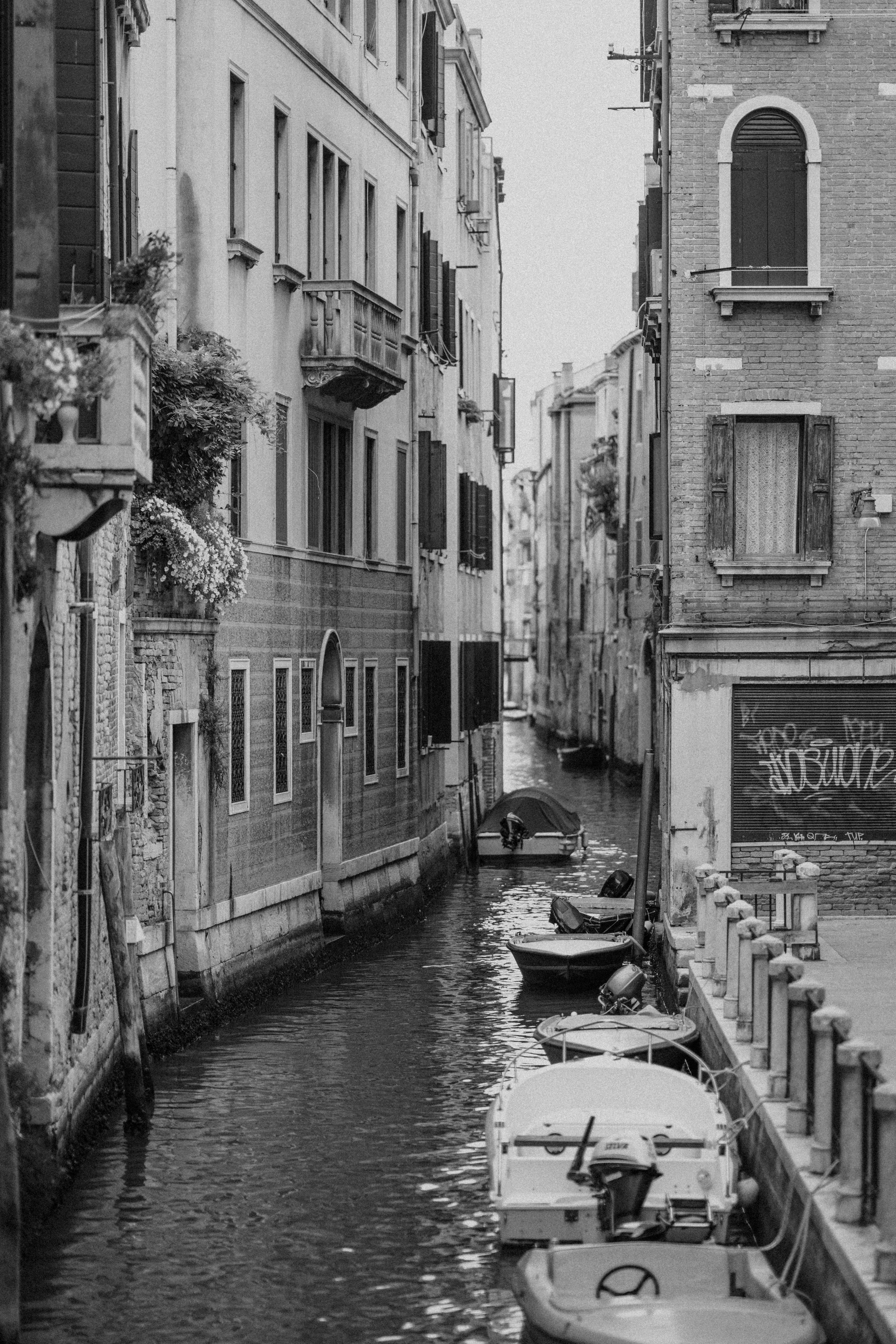 A black and white photo of a canal in a city photo – Free Venice Image ...