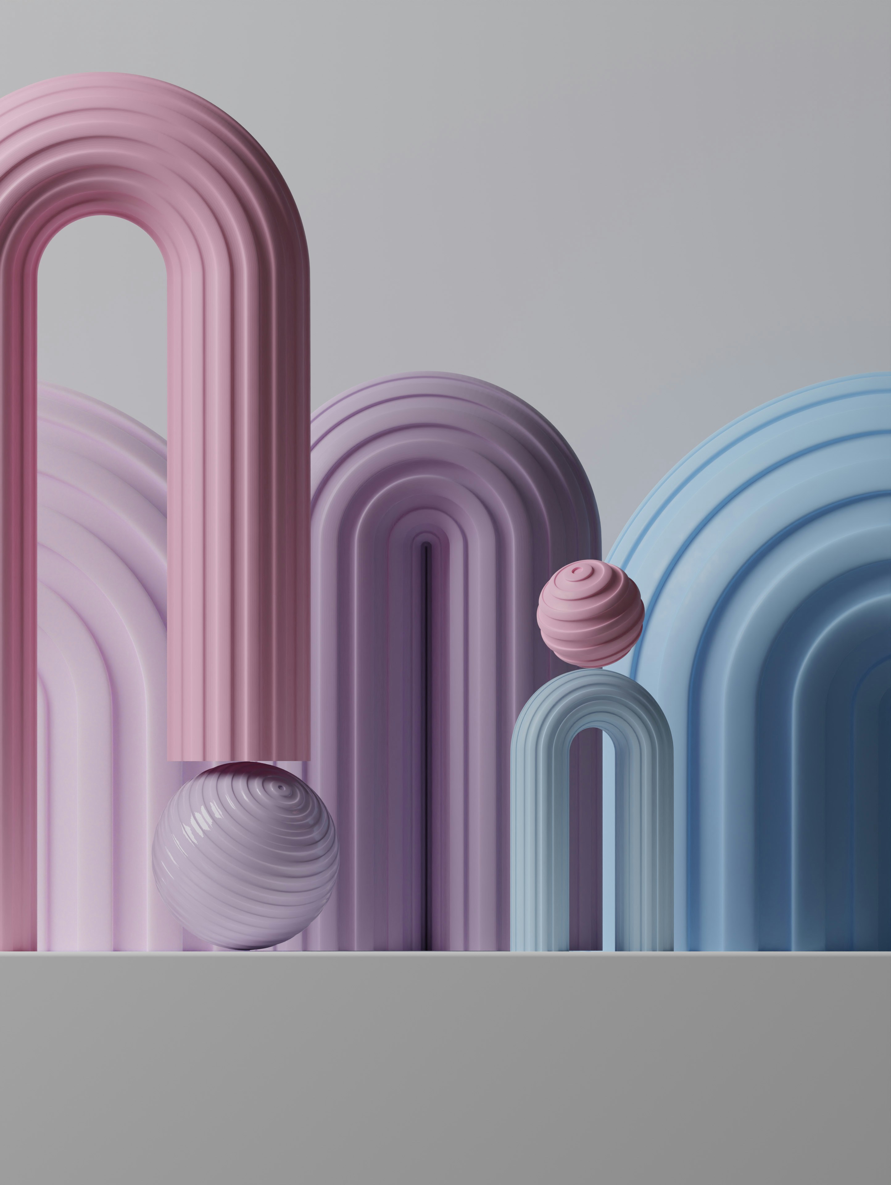 A group of pink, blue, and purple objects sitting on top of a table ...