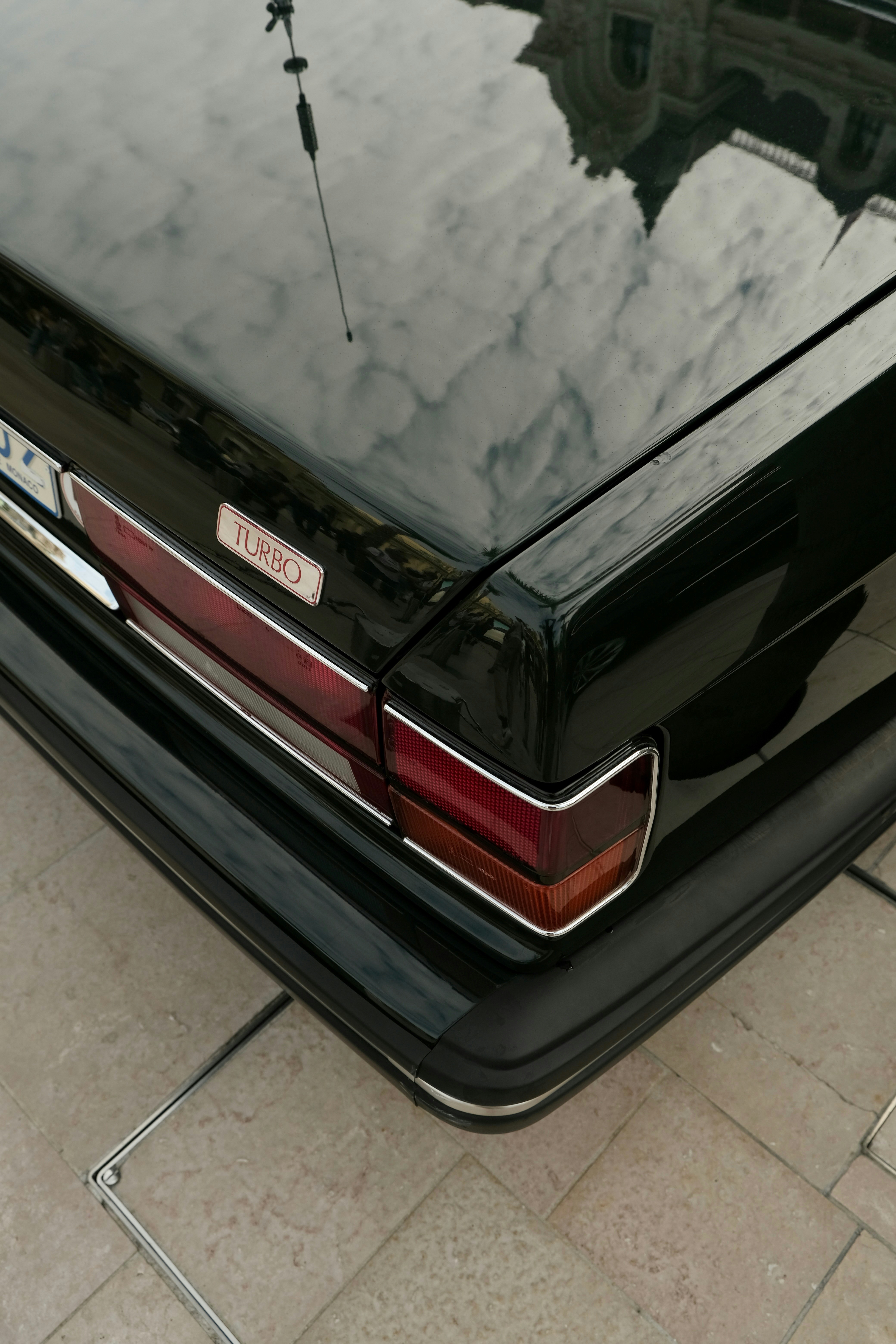 A black car parked on the side of the road photo – Free Rear Image on ...