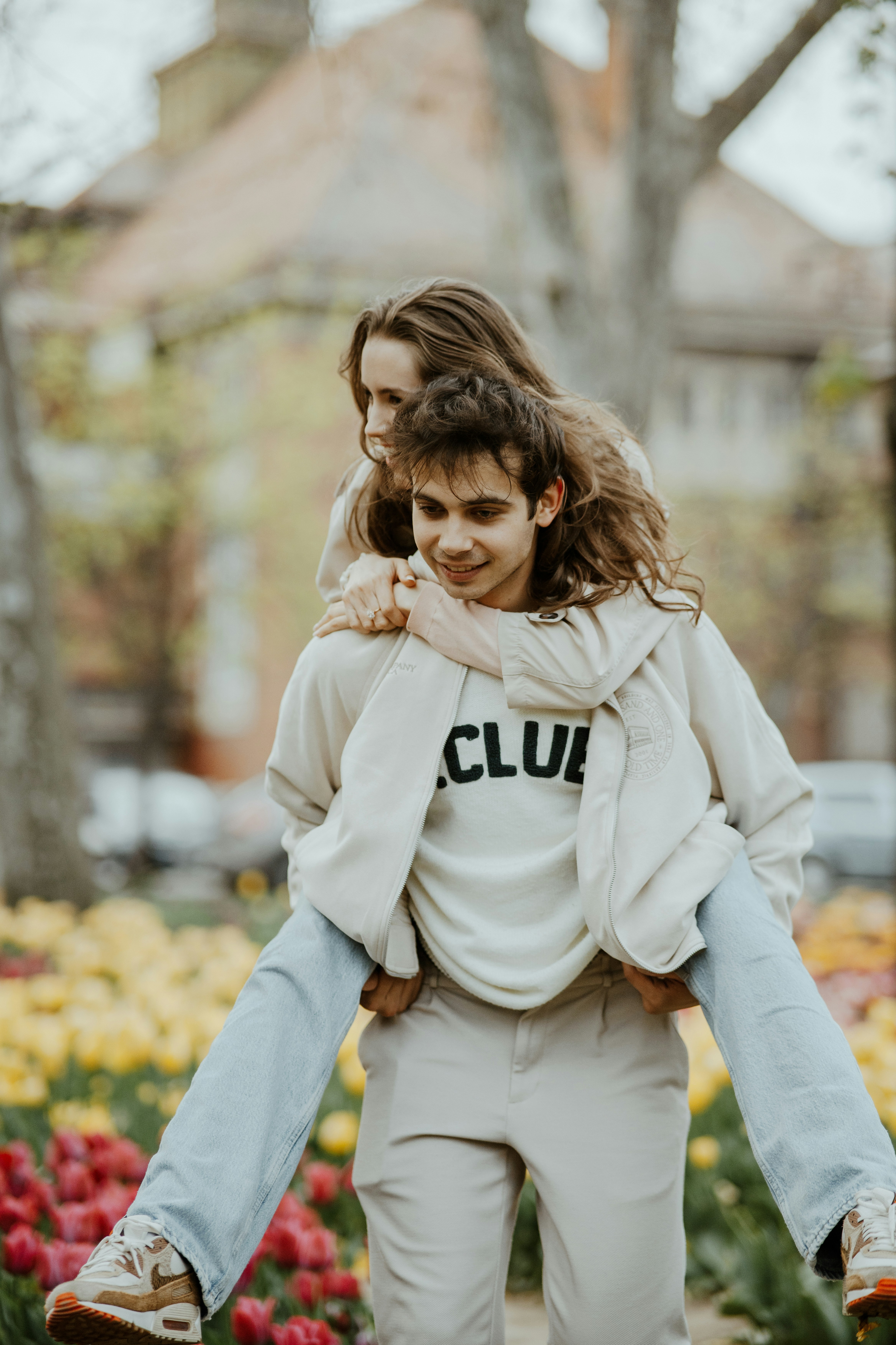 a man carrying a woman on his back