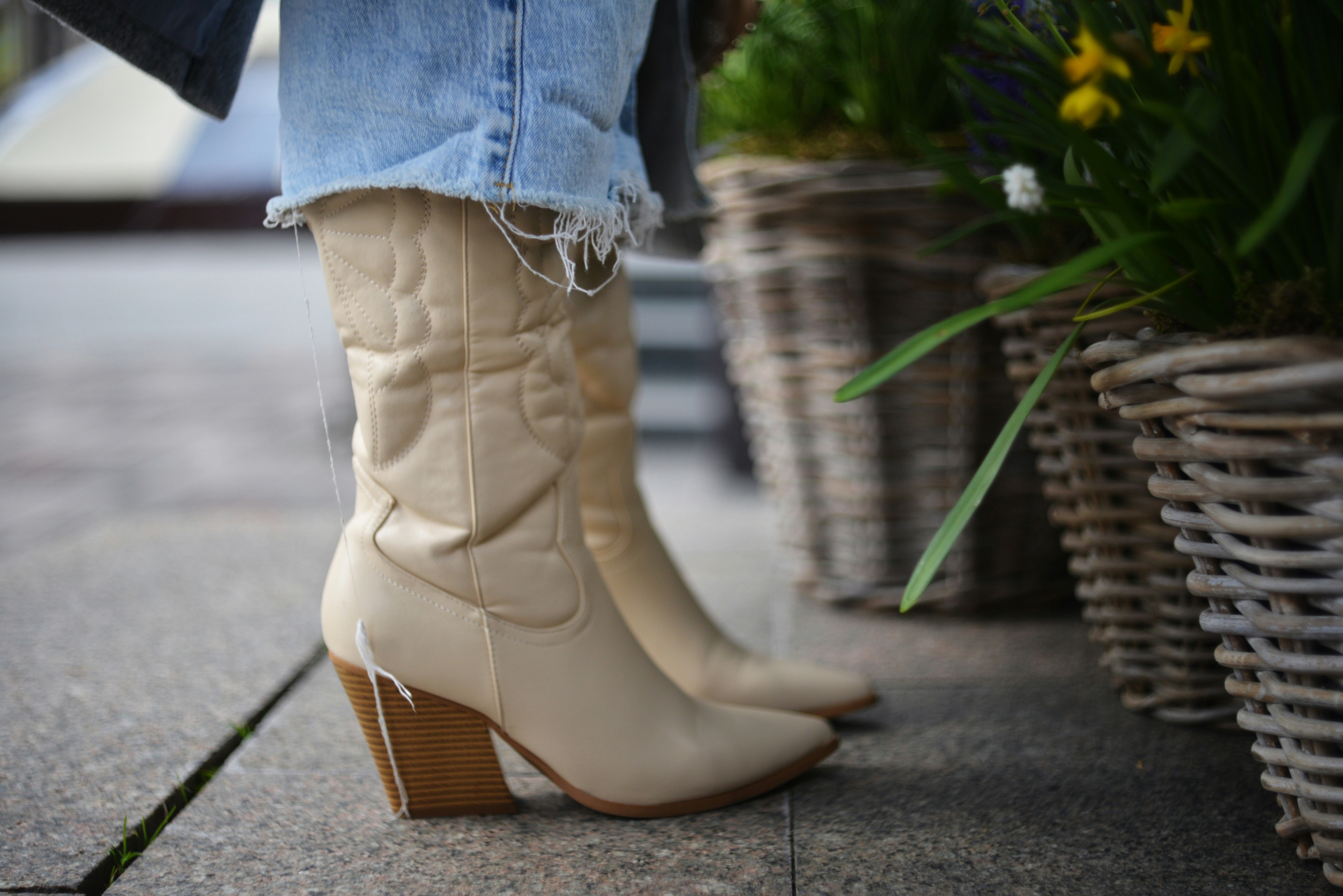 A close up of a person's legs wearing cowboy boots photo – Free Ukraine ...