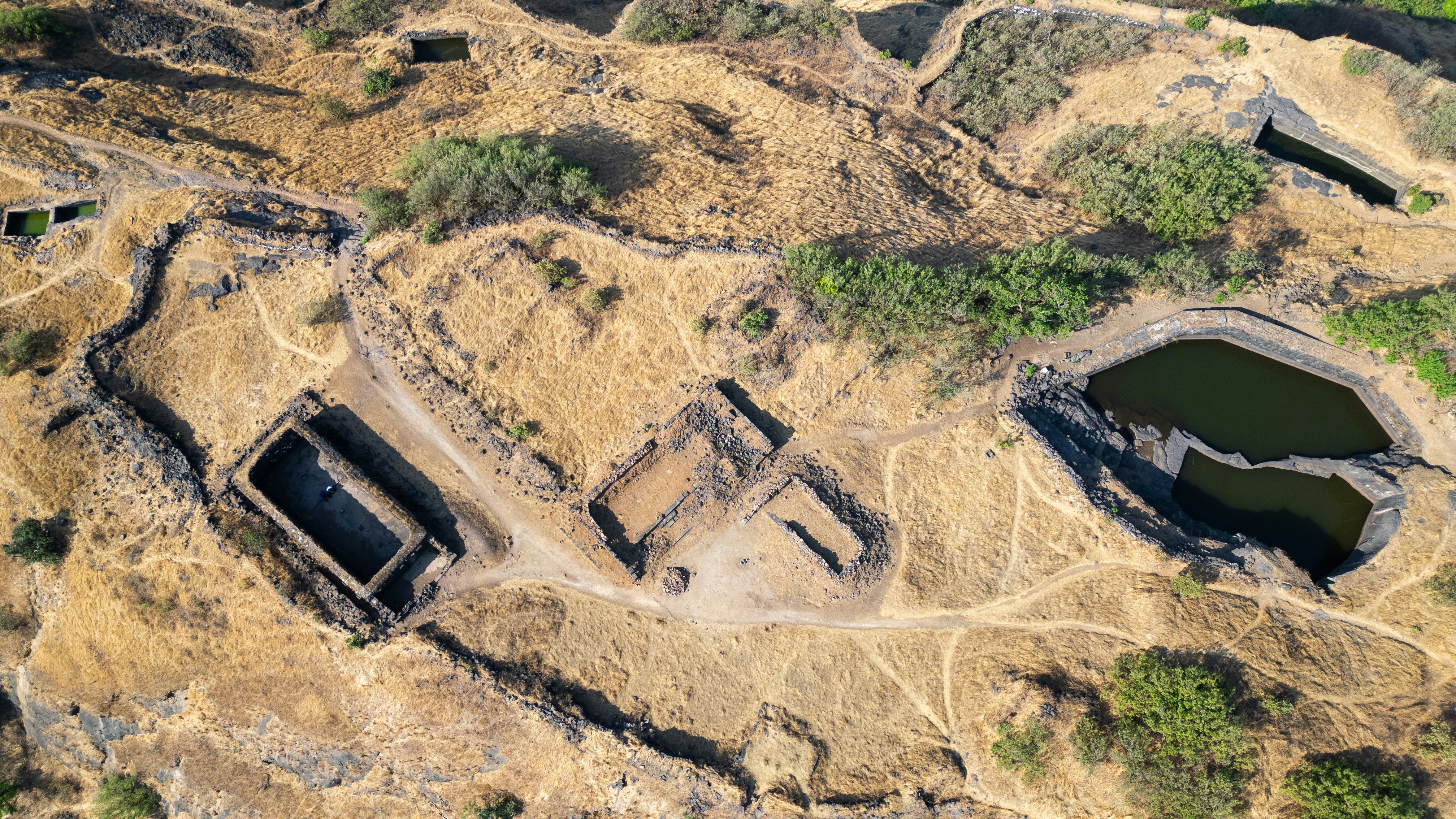 Ancient Quarry Layout: Aerial X-shaped Tunnels and Rimmed Ponds