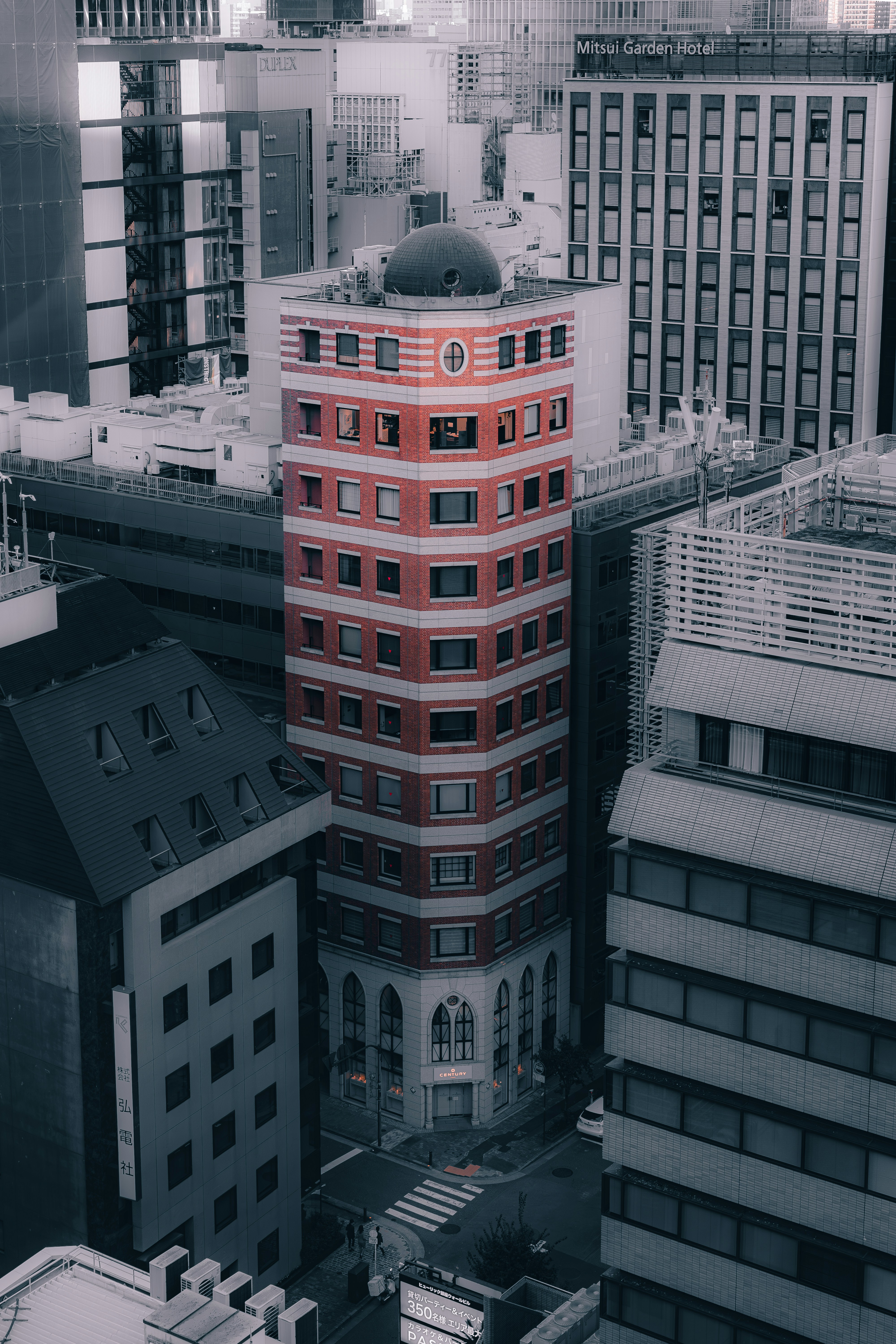 Dome-Topped Brick Beacon Between Glass Giants