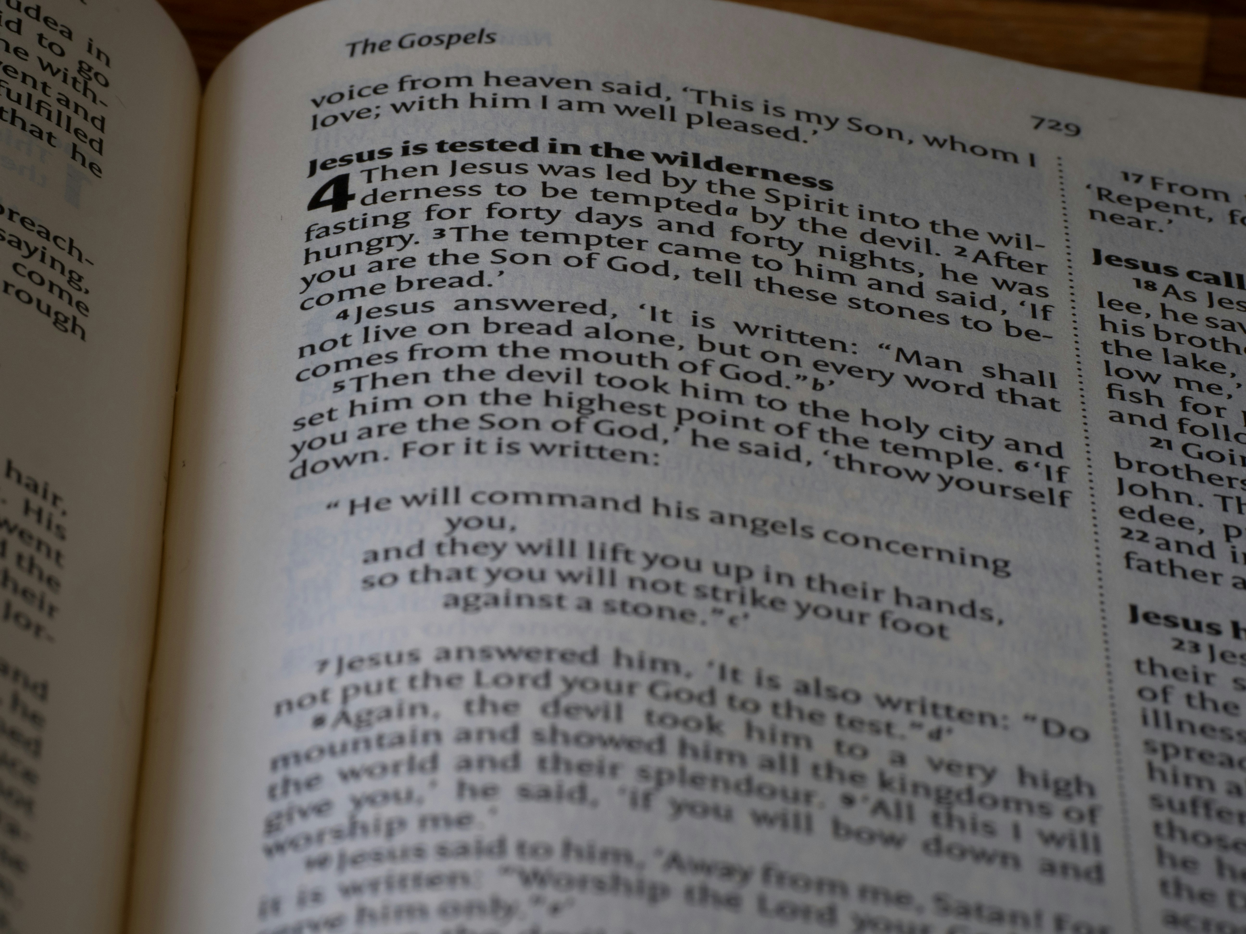 Close-up of a well-worn Bible page: faded text and soft edge wear
