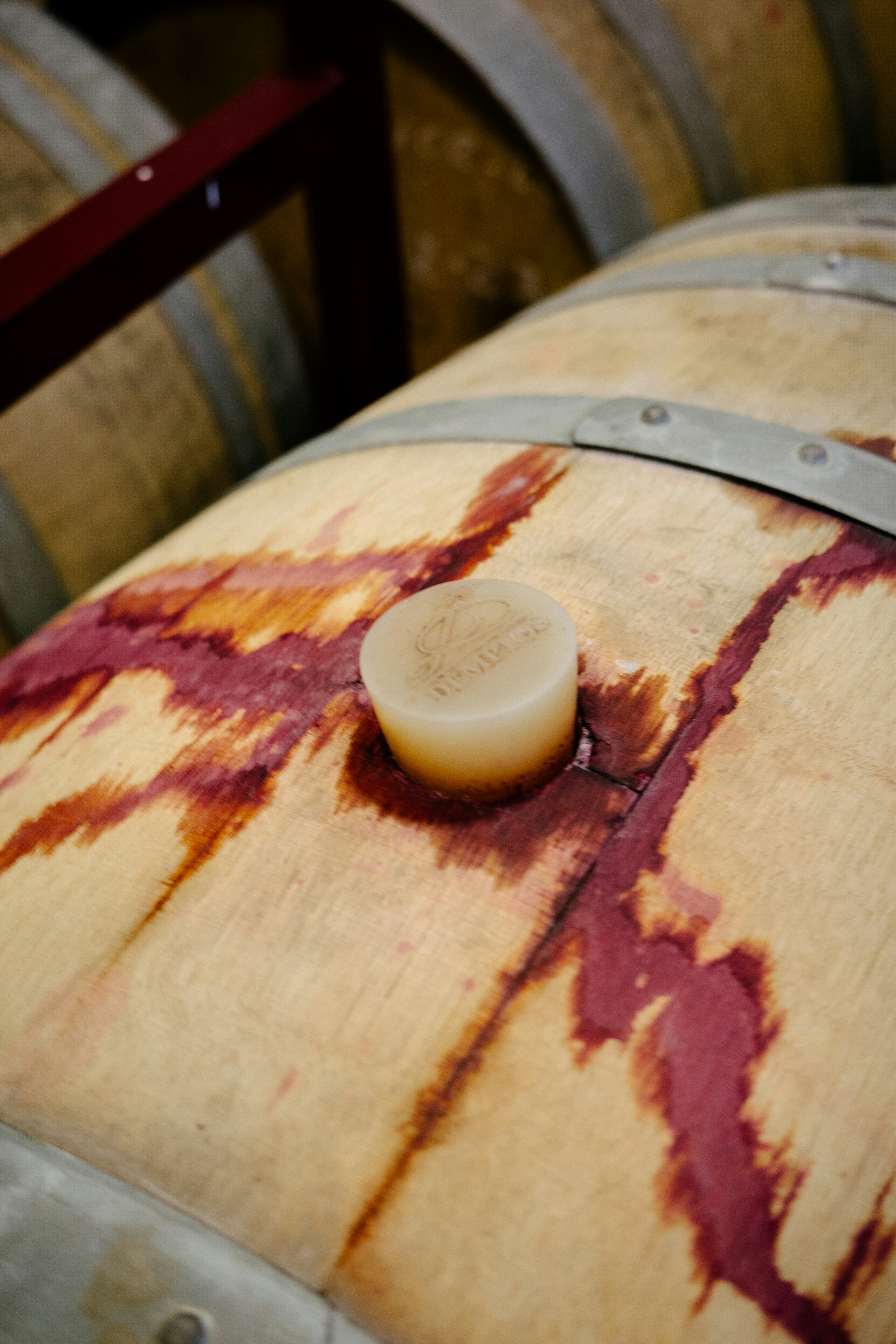 Seal on Weathered Oak: Close-Up of a Wine Barrel Cap