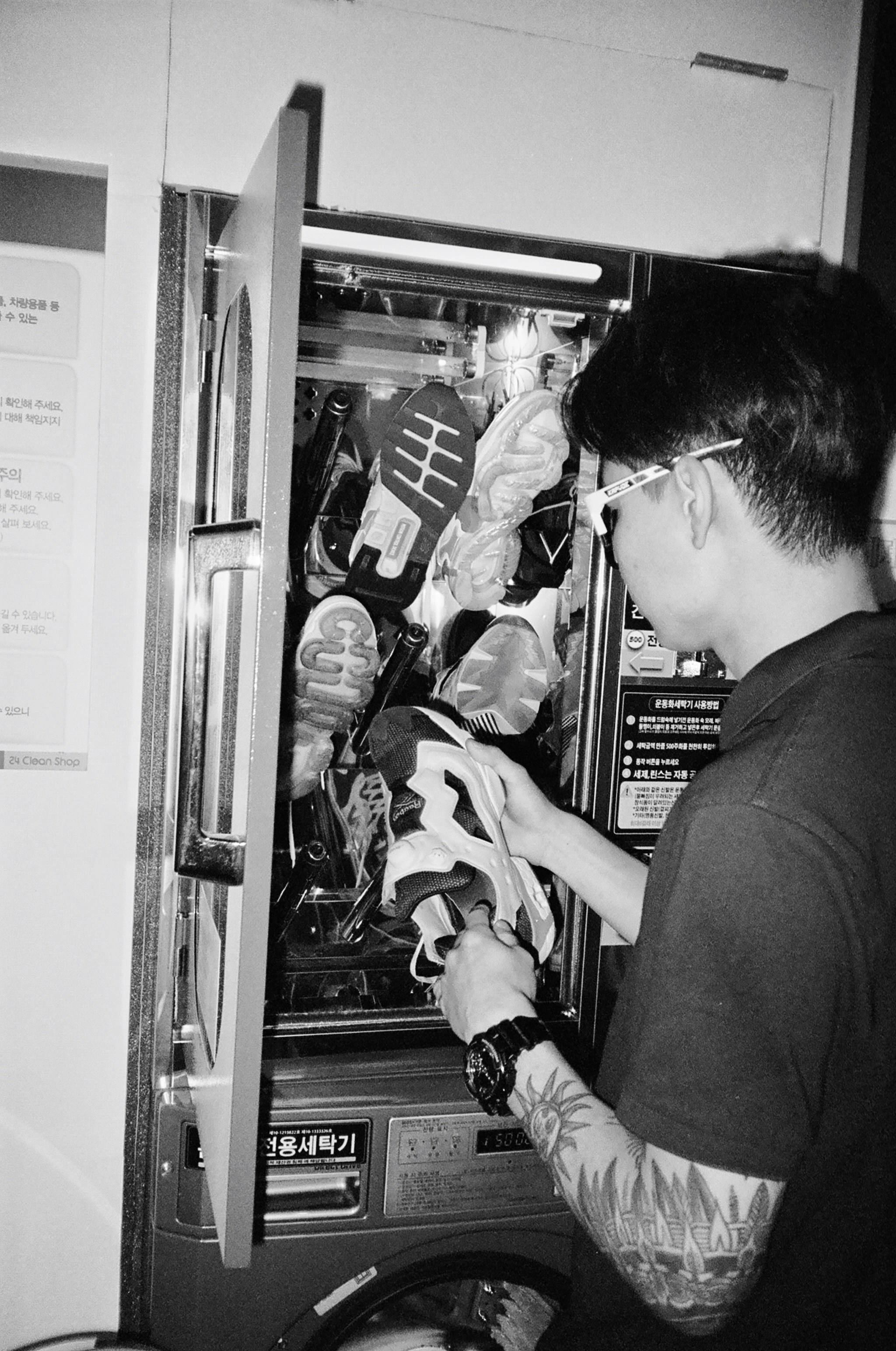 A man opening a vending machine in a kitchen photo – Free Human Image ...