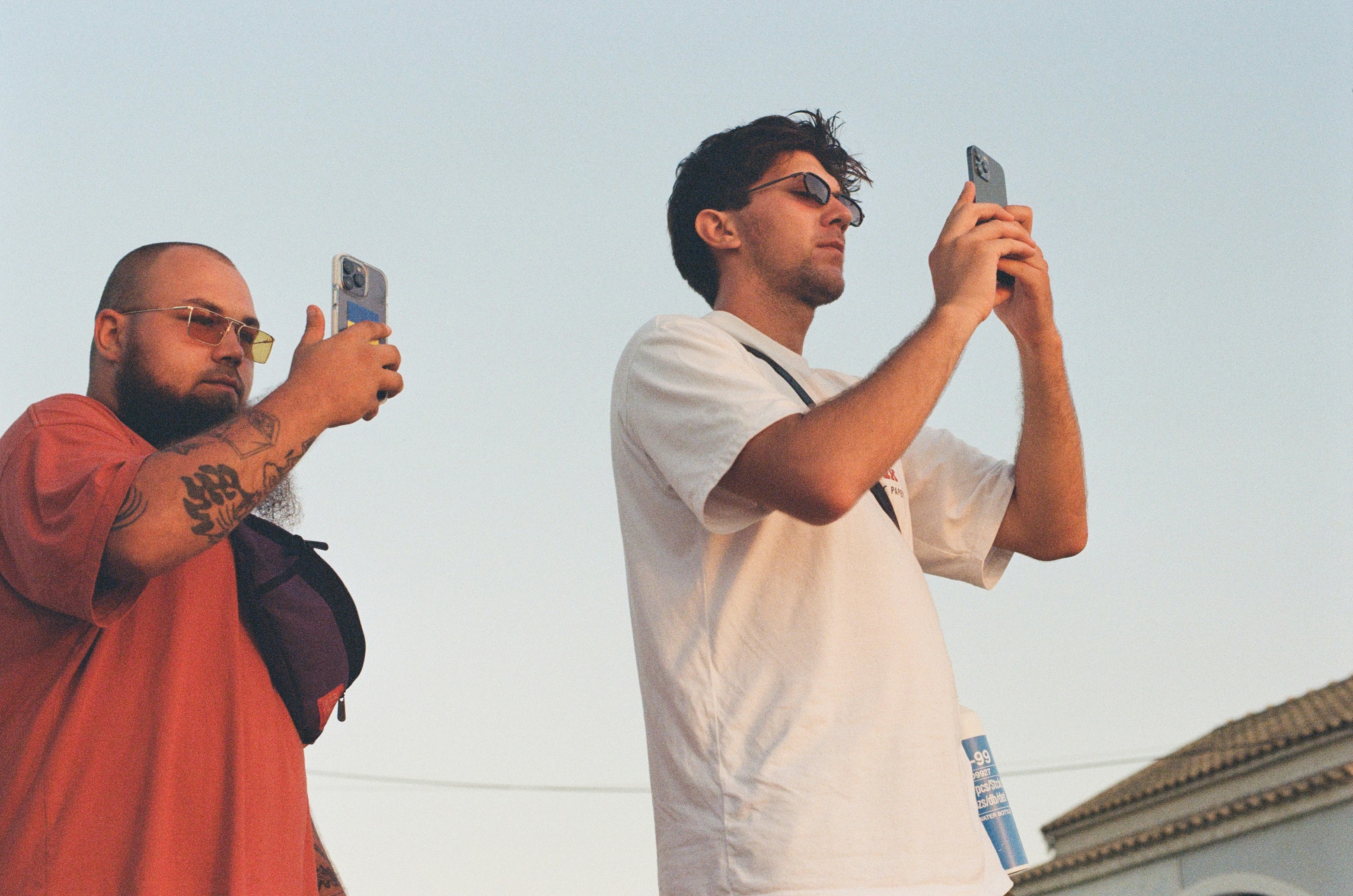 Two men taking pictures with their cell phones photo – Free Portrait ...