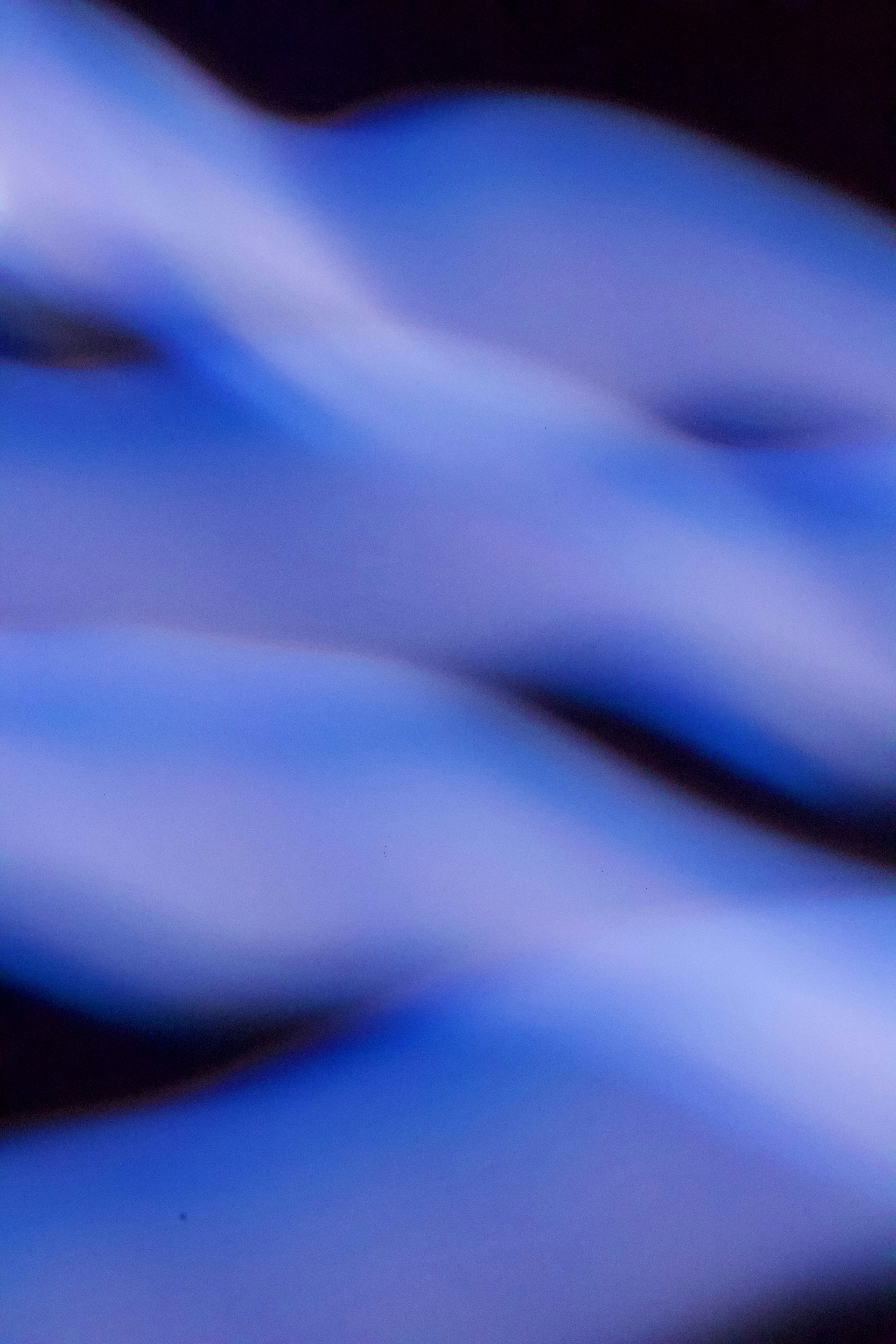 A blurry photo of a blue object in the air photo – Free Pattern Image ...