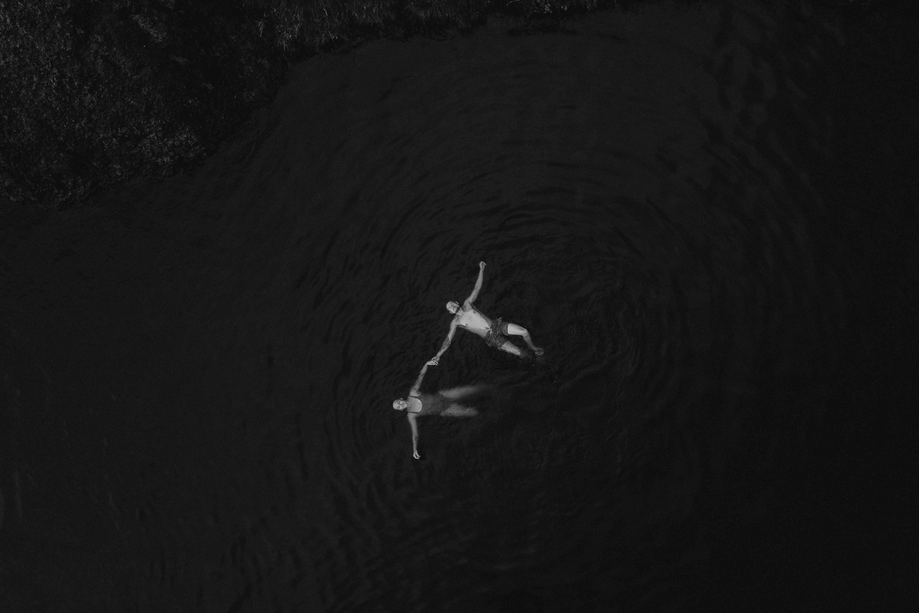 A person floating in a body of water photo – Free Hruni Image on Unsplash