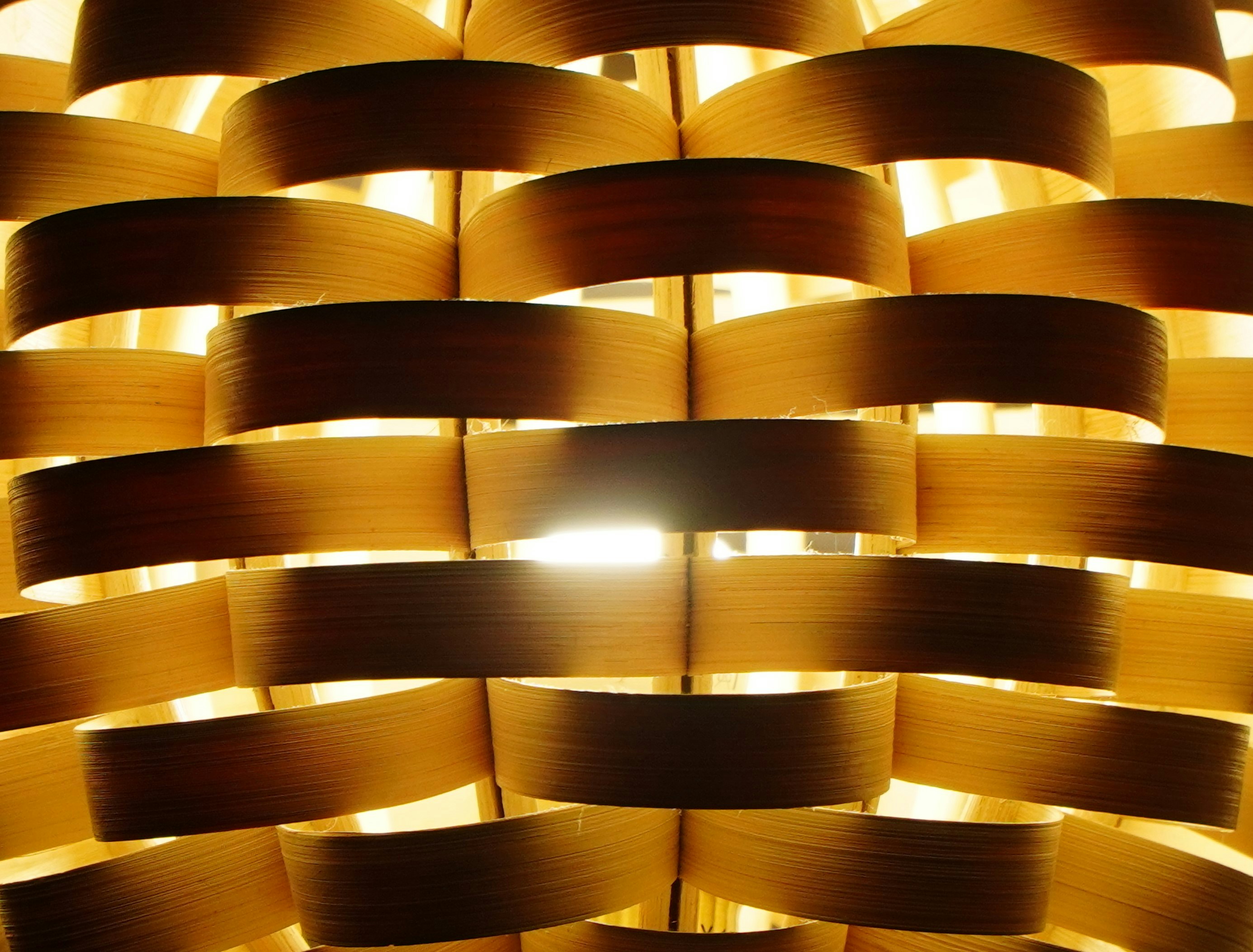 A light shines through a wooden structure photo – Free Waves Image on ...