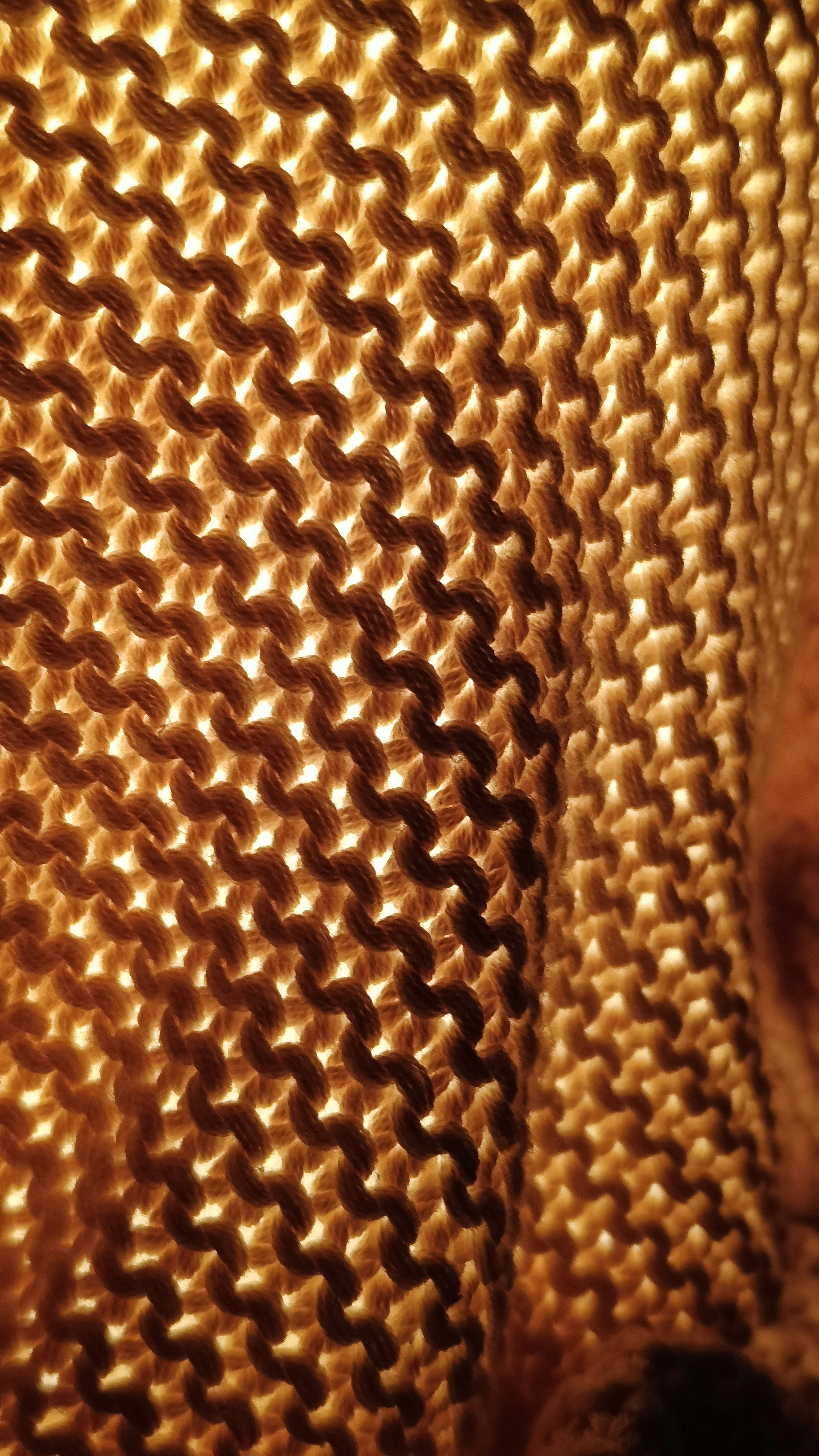 Amber Knit Macro: Close-Up of Gilded Loops