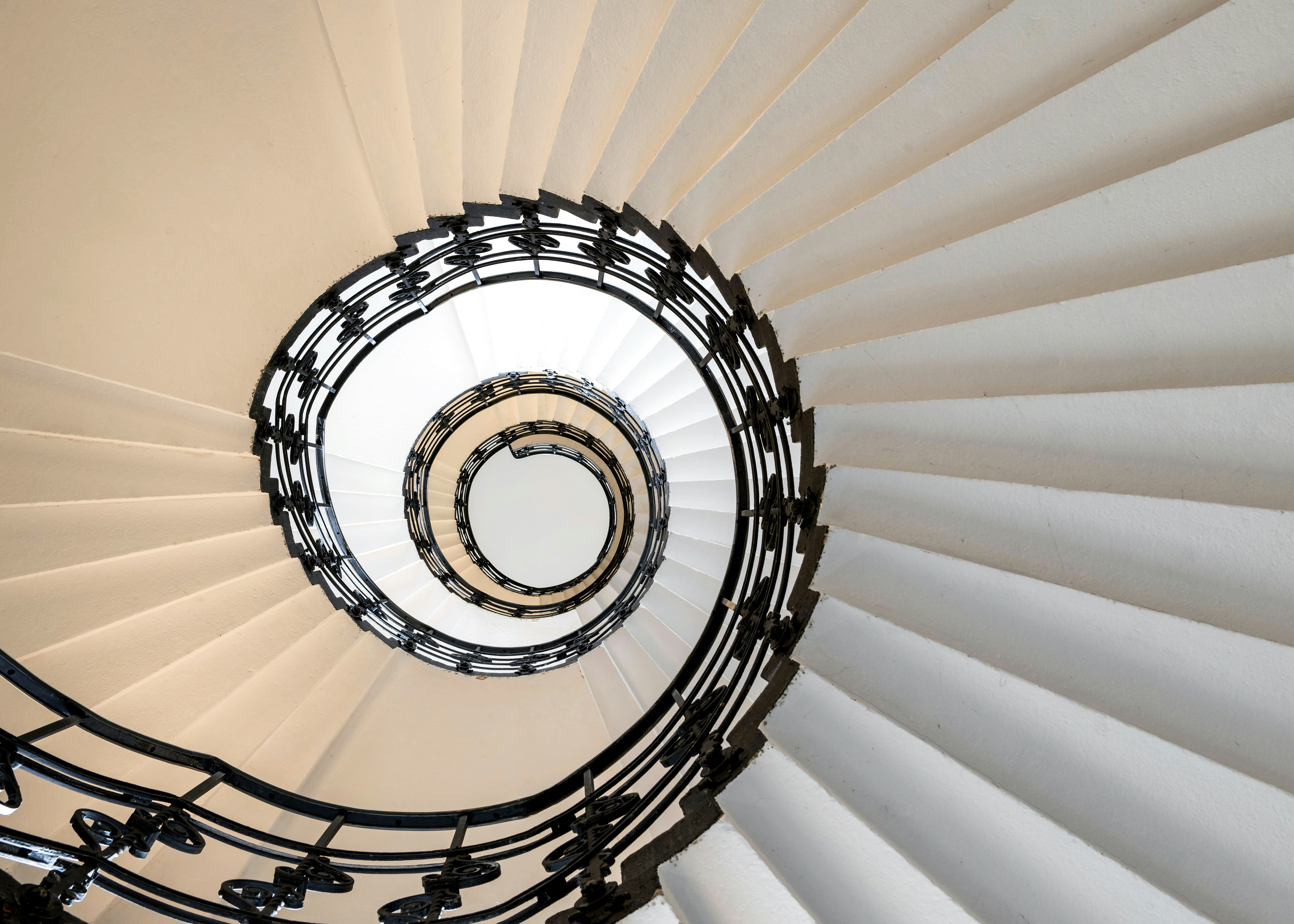 Concentric Descent: A Spiral Staircase Reaching for Light