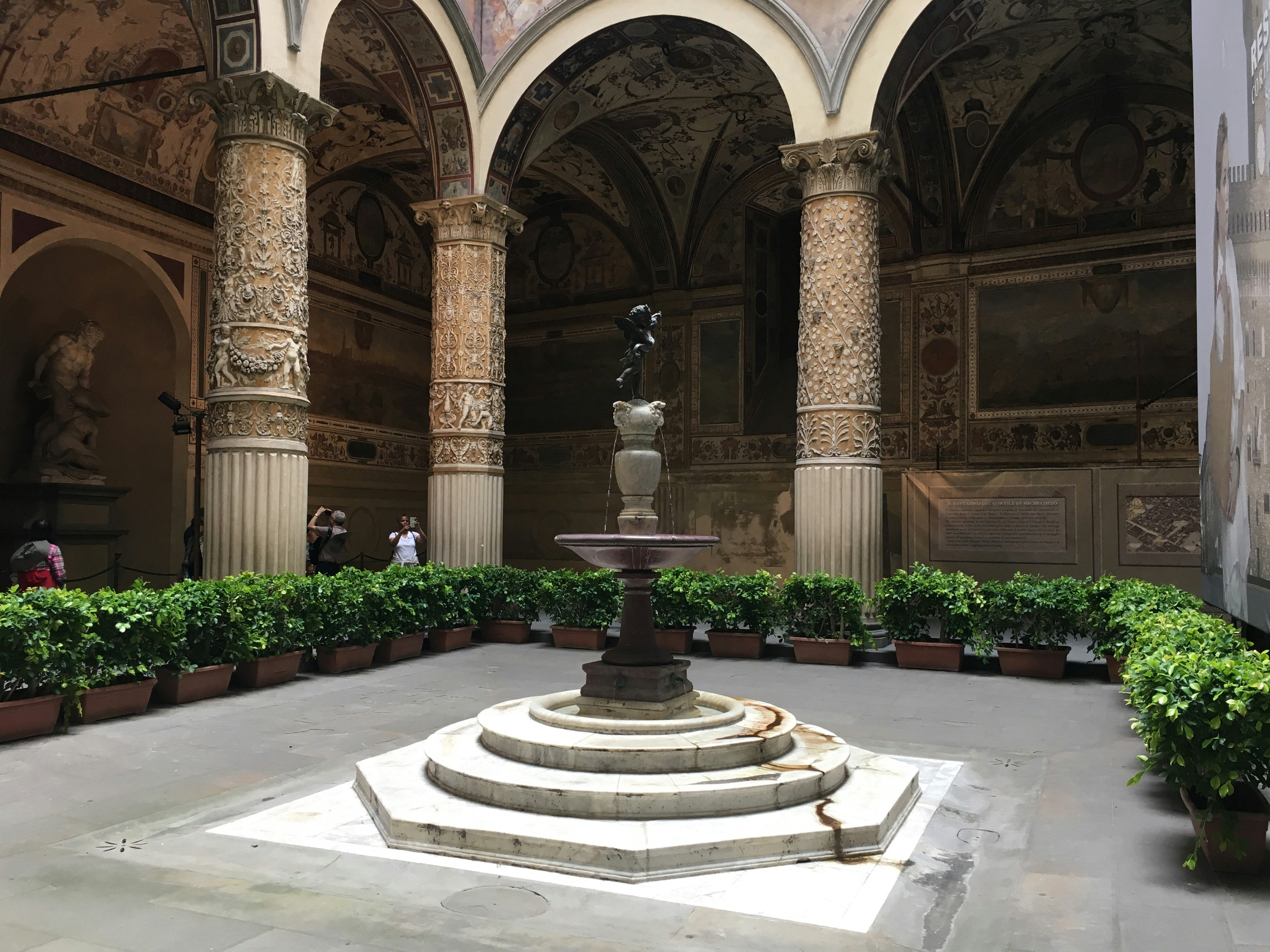 Central Fountain Surrounded by Historic Arcades