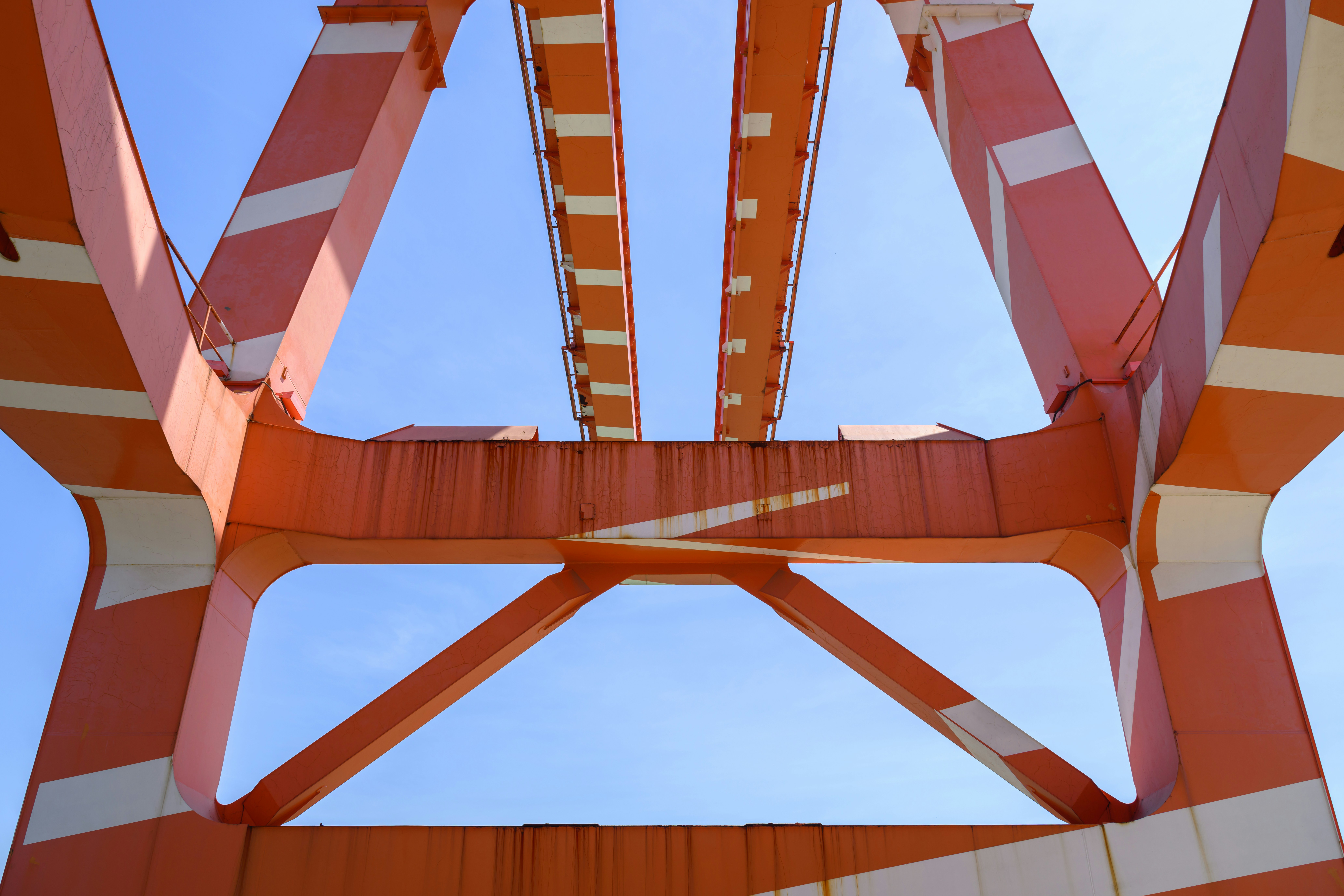 Underbelly of a Burnt-Orange Steel Lattice
