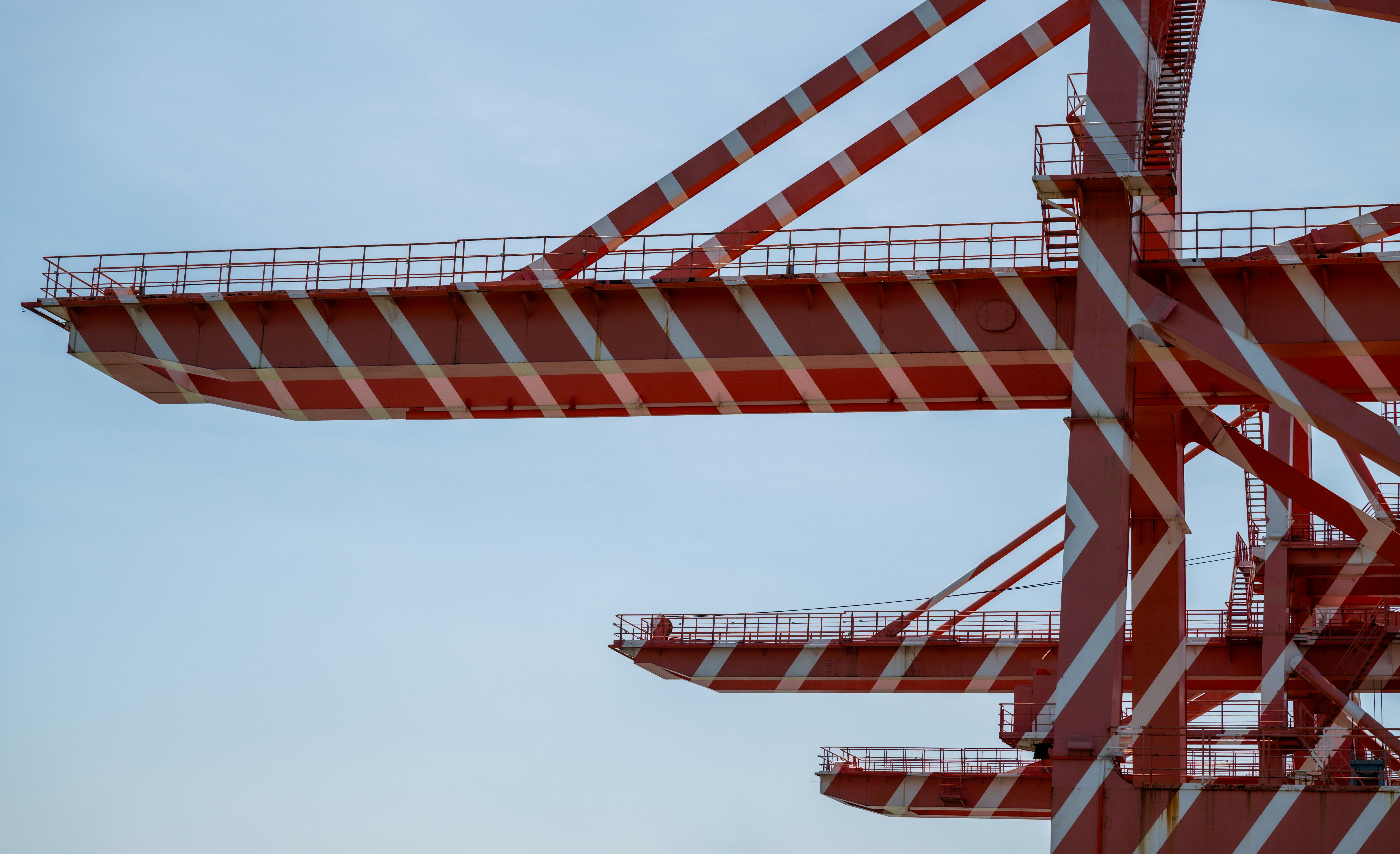 Red Crane Arches: A Skyward Chorus of Industrial Geometry