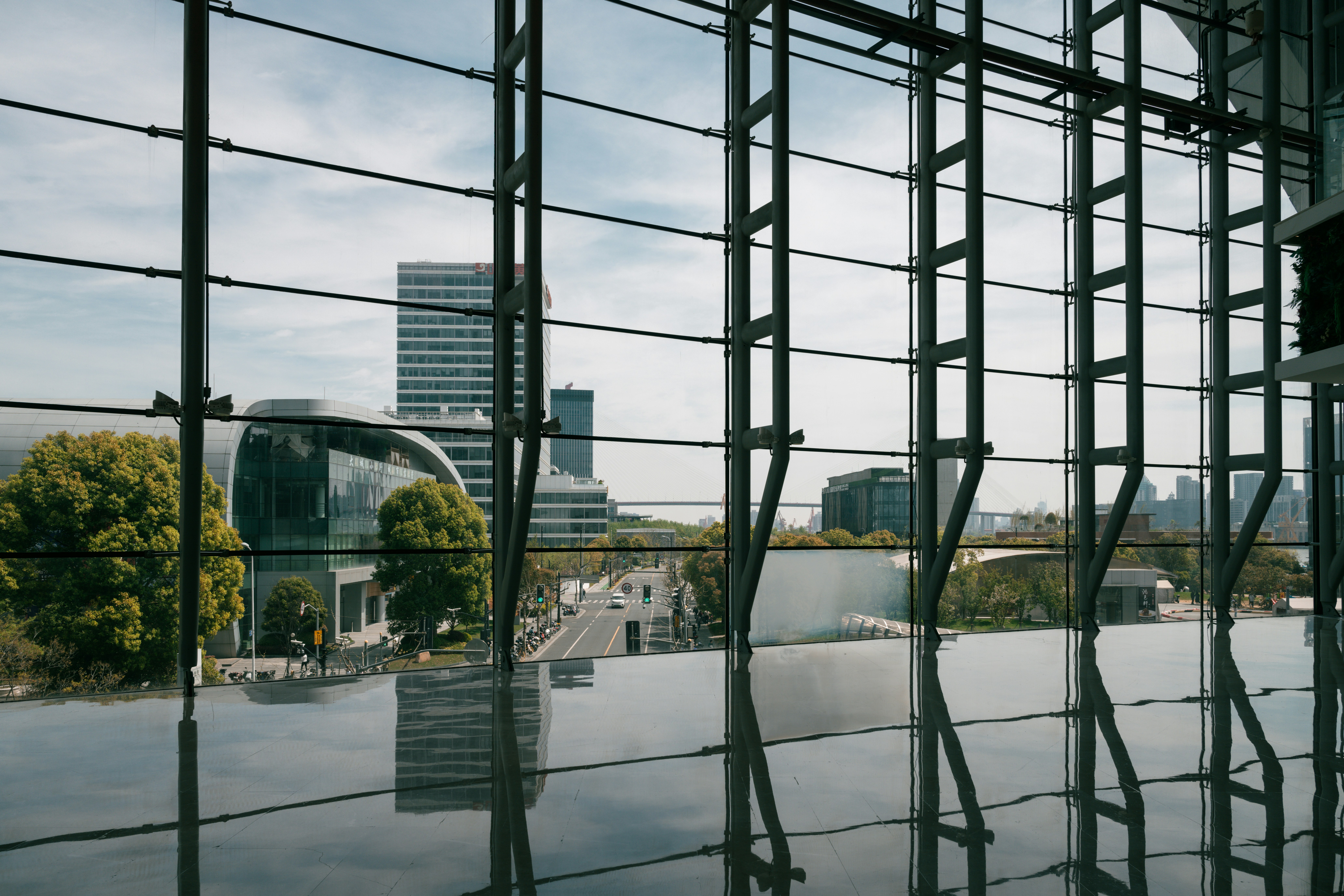 A view of a city through a glass window photo – Free Building Image on ...