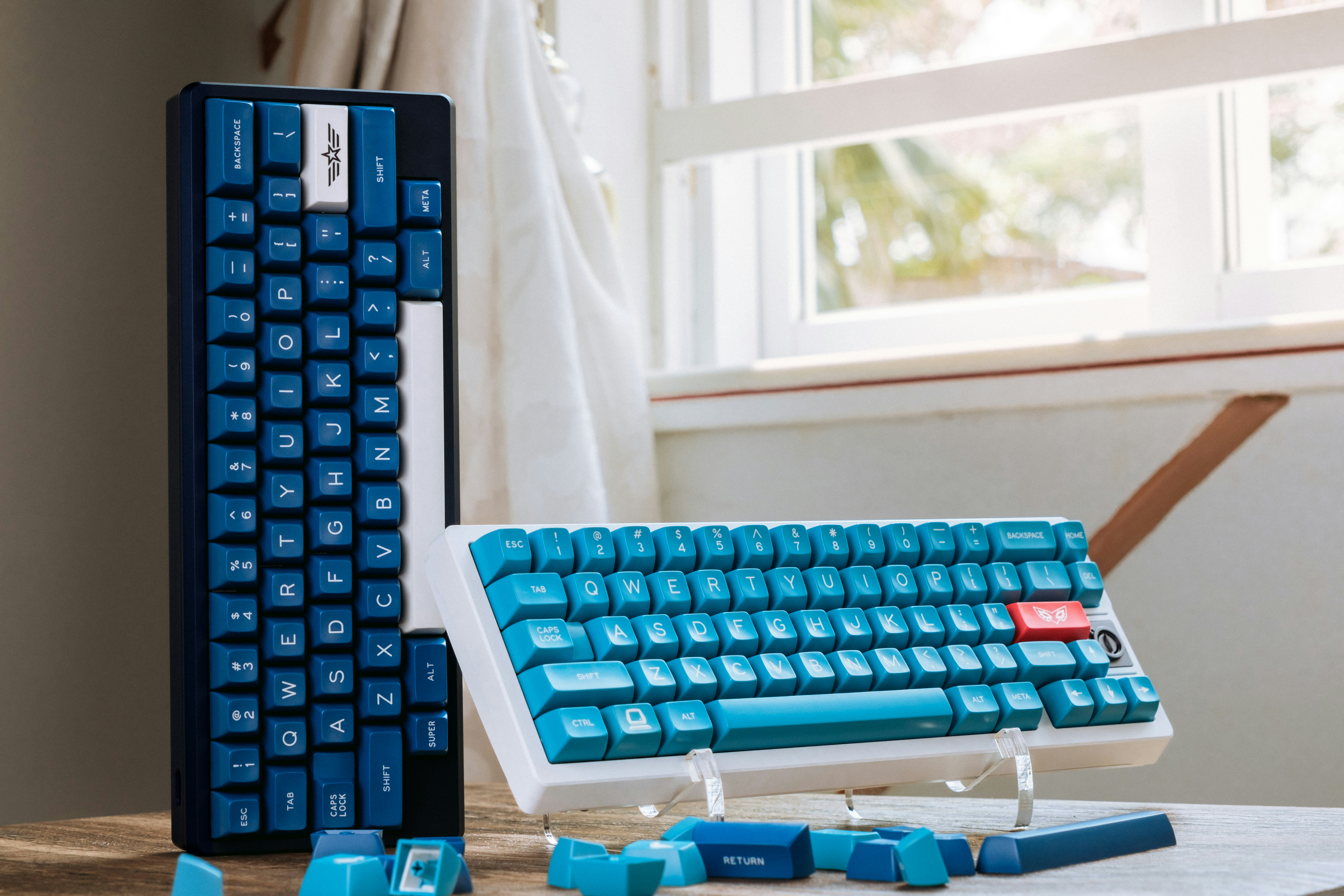A blue and white keyboard sitting on top of a table photo – Free Setup ...