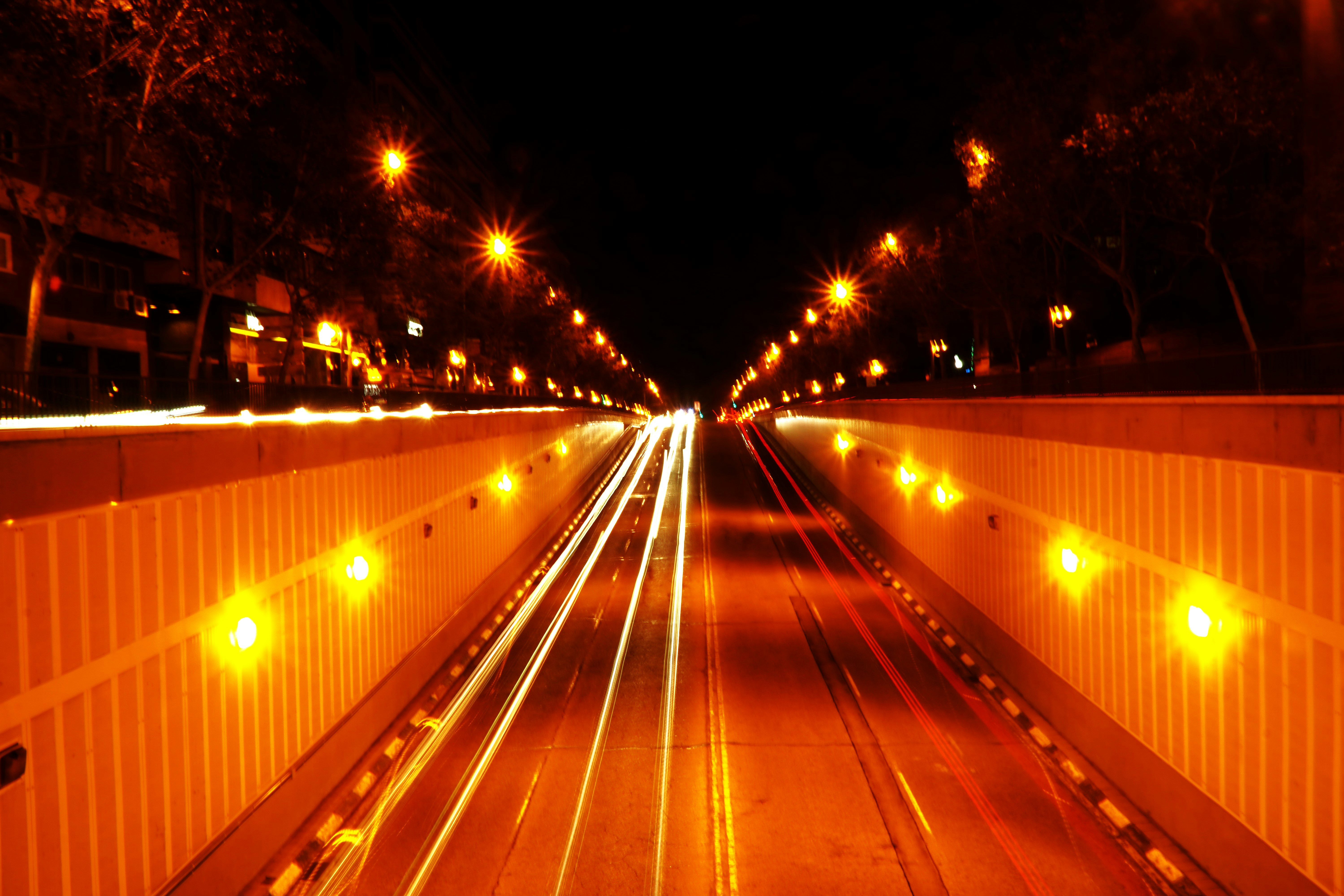 A long exposure photo of a train track at night photo – Free Tunnel ...