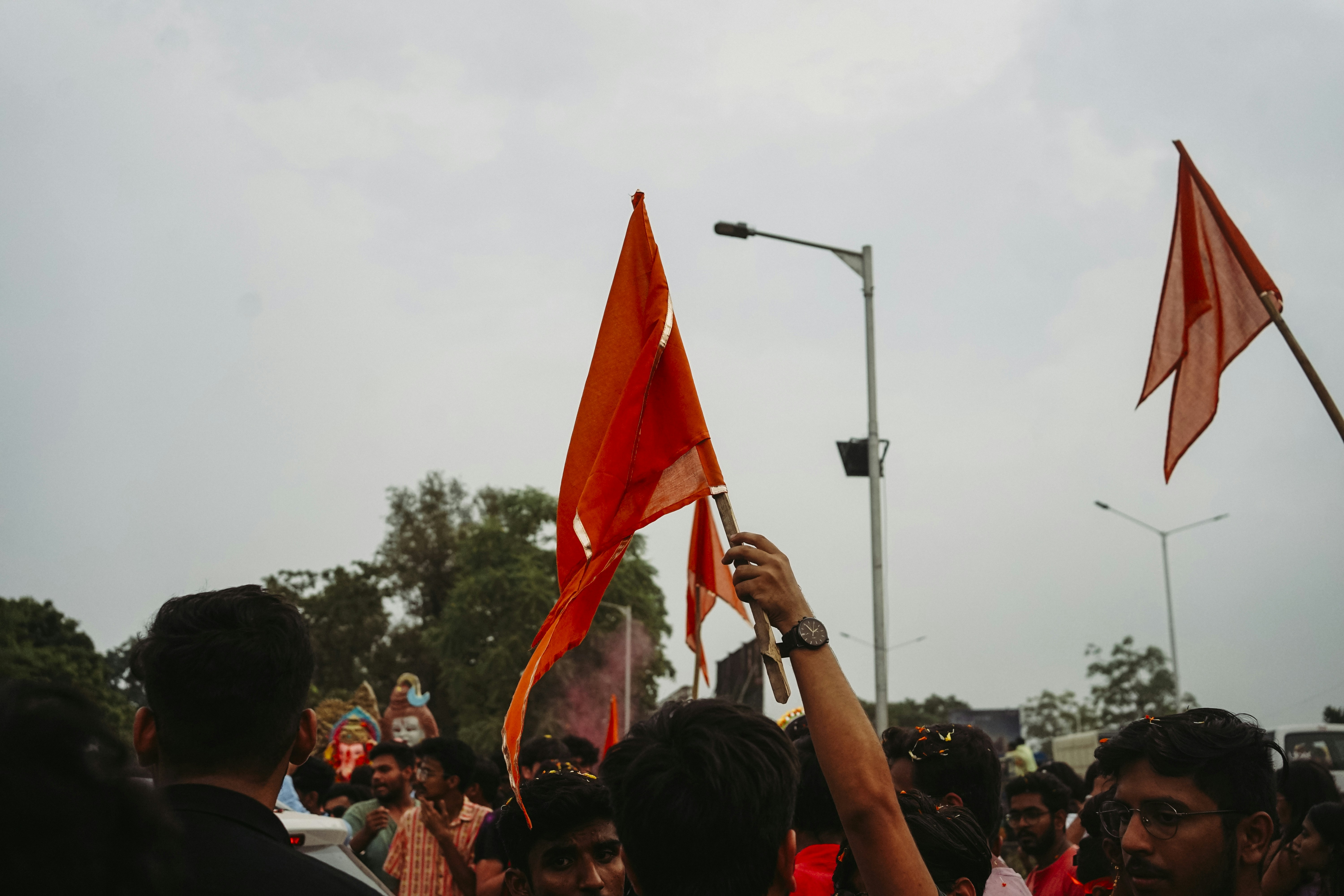 A crowd of people holding up red flags photo – Free Adult Image on Unsplash