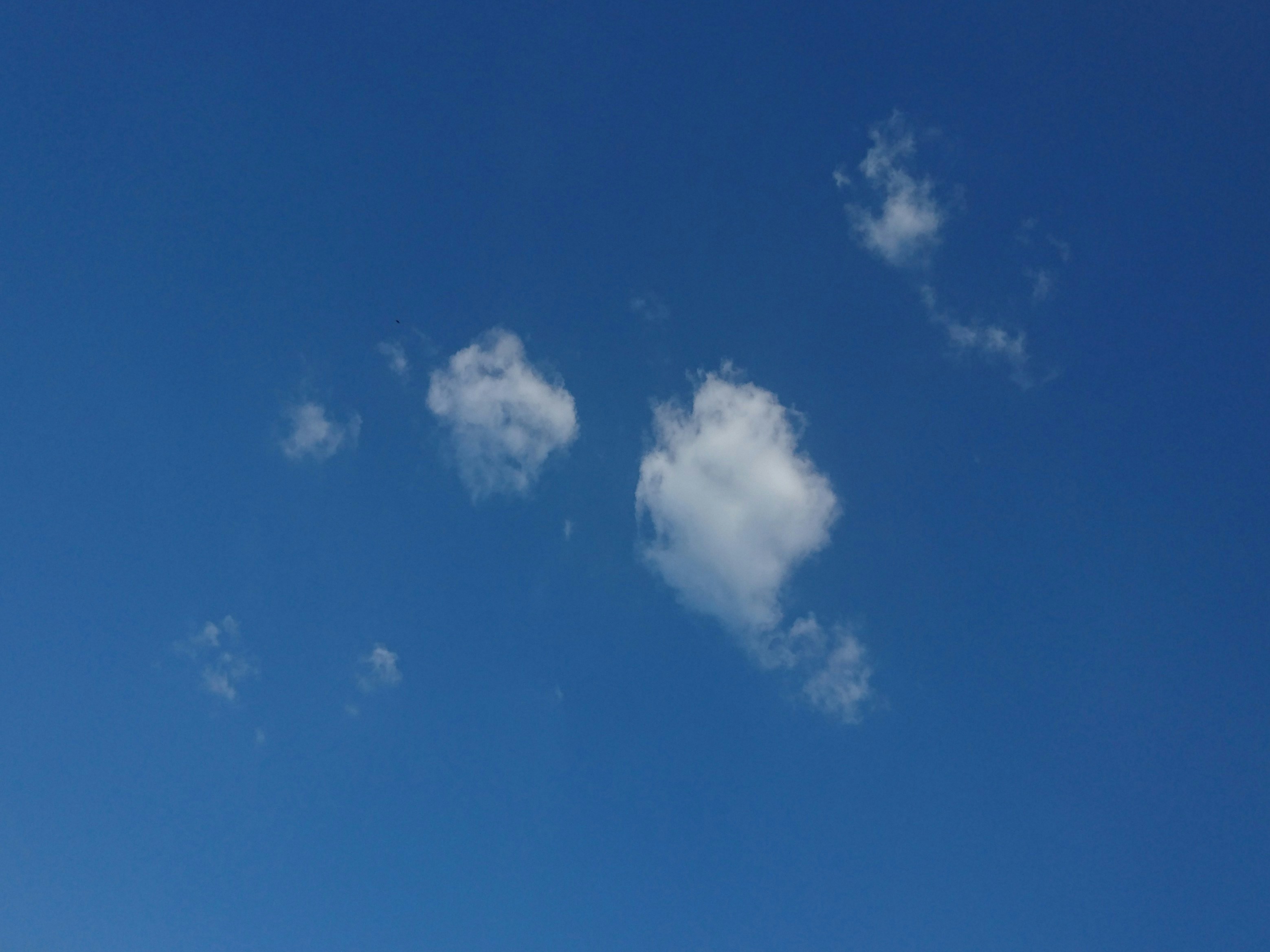 a blue sky with some clouds in it