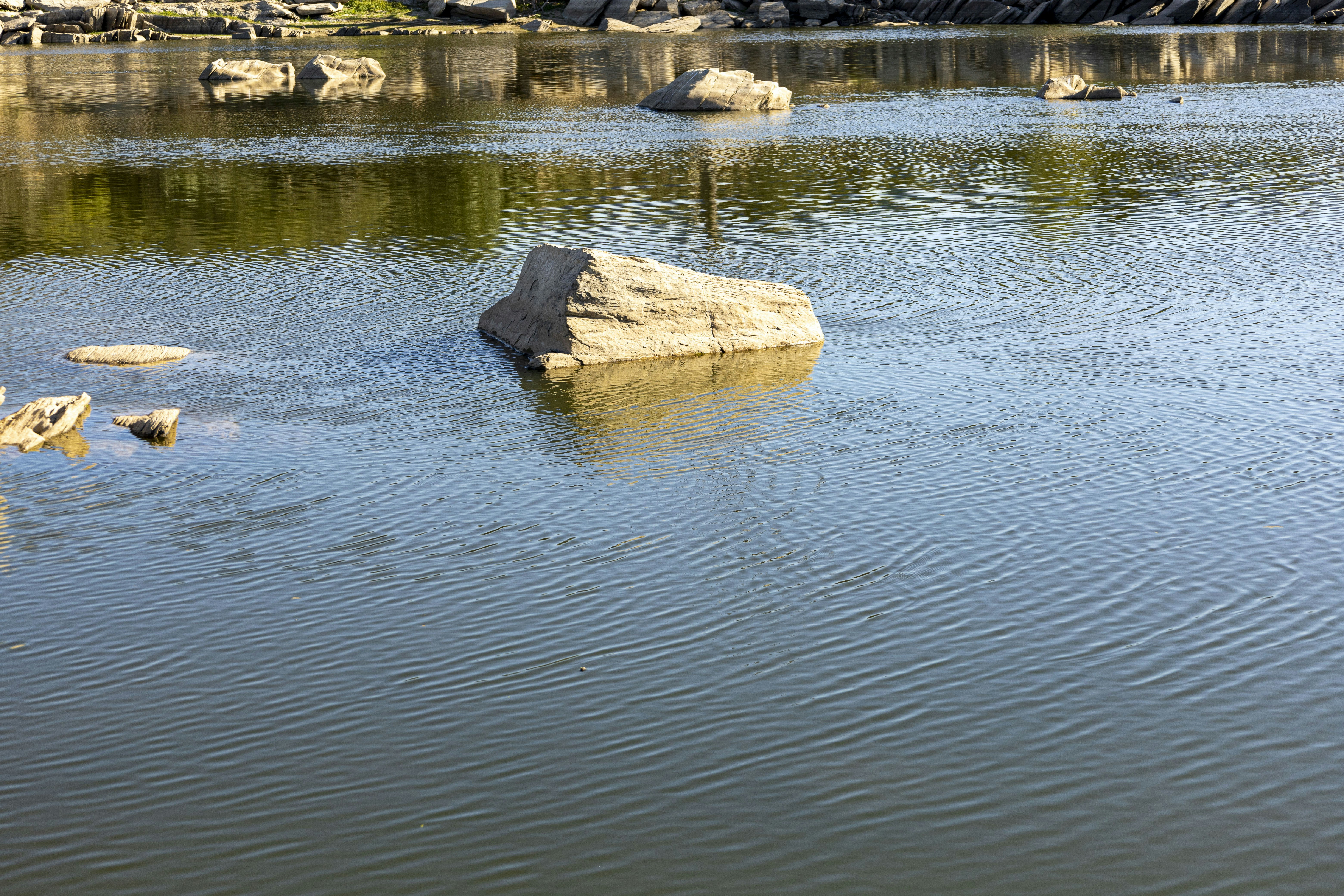 Lone Rock Reigns Over a Glassy Lake