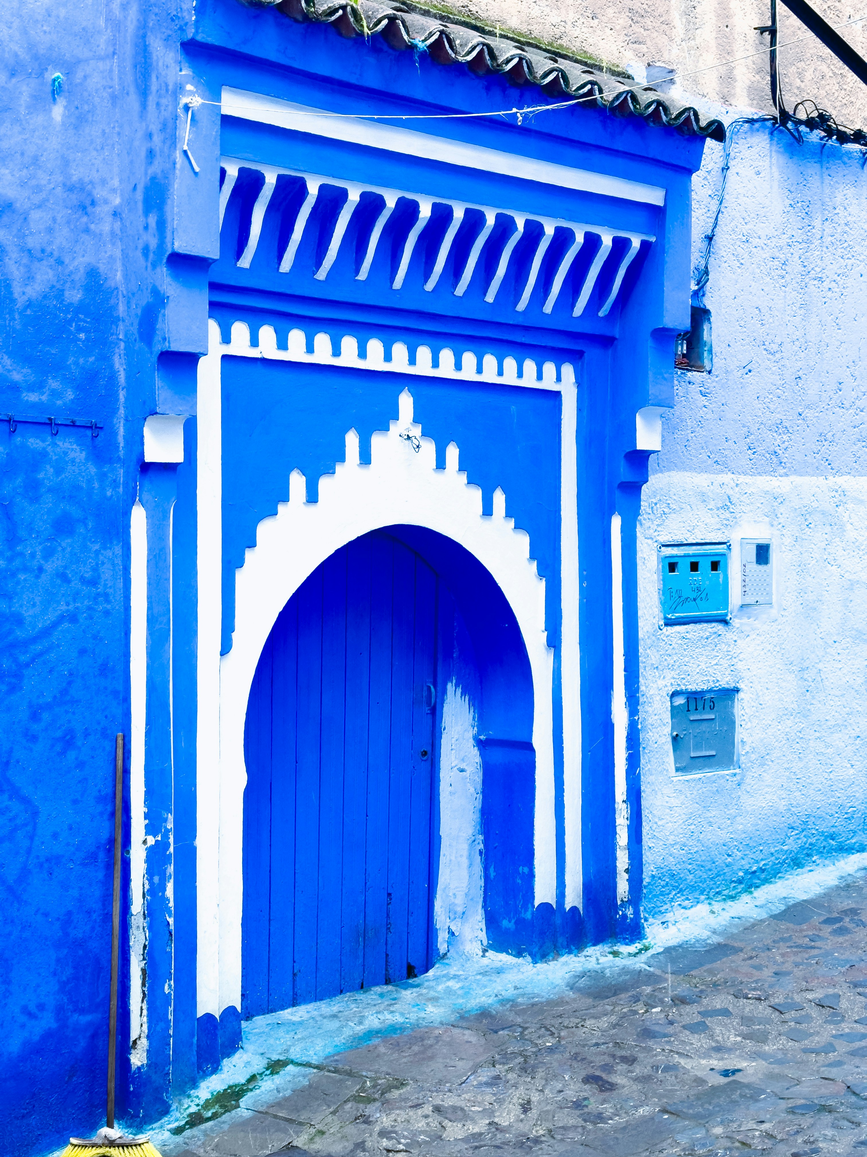 Cerulean Archway: Moorish Blue Doorway in the Sunlit Street