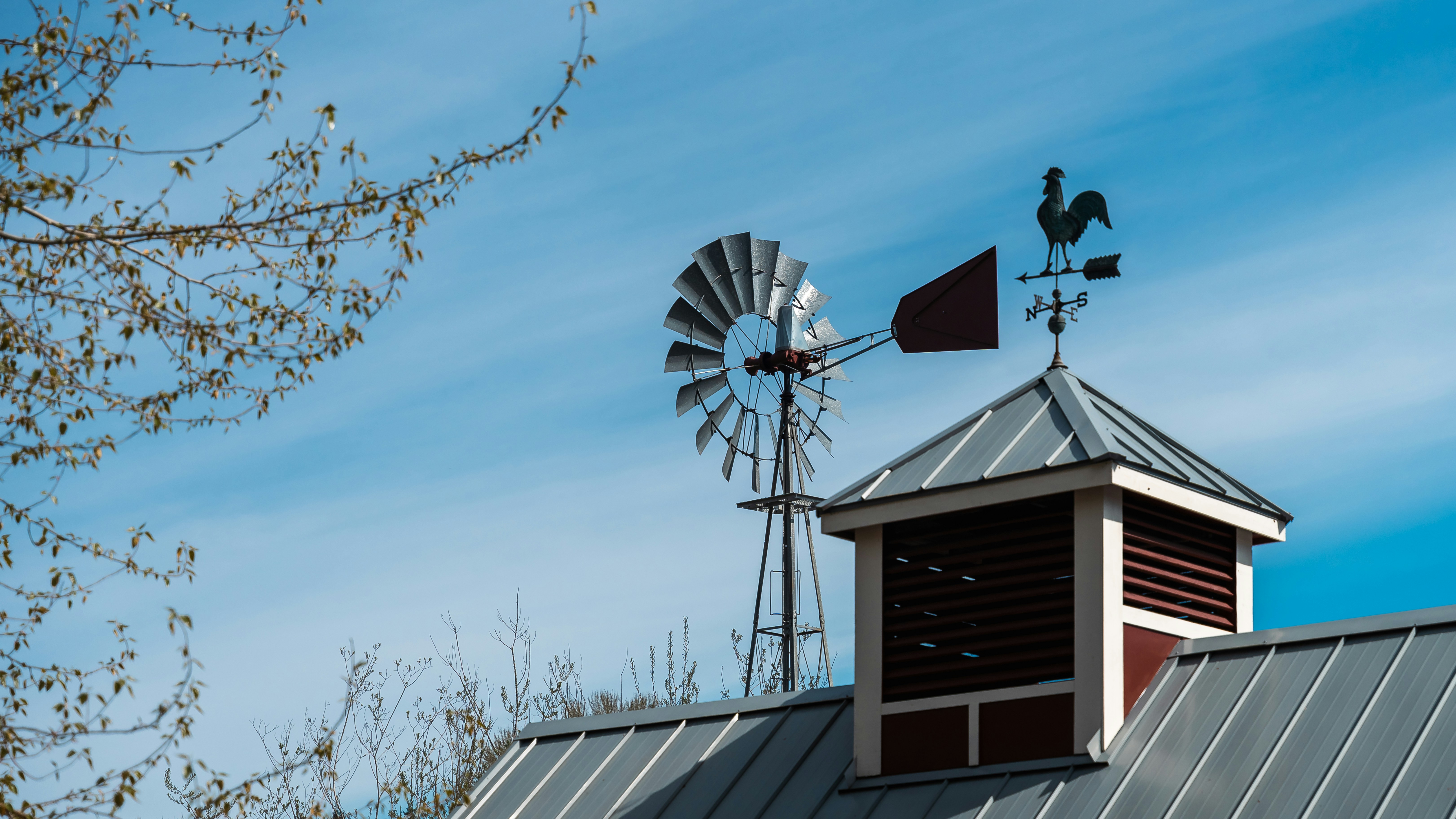 Rooftop Windmill Under a Clear Blue Sky