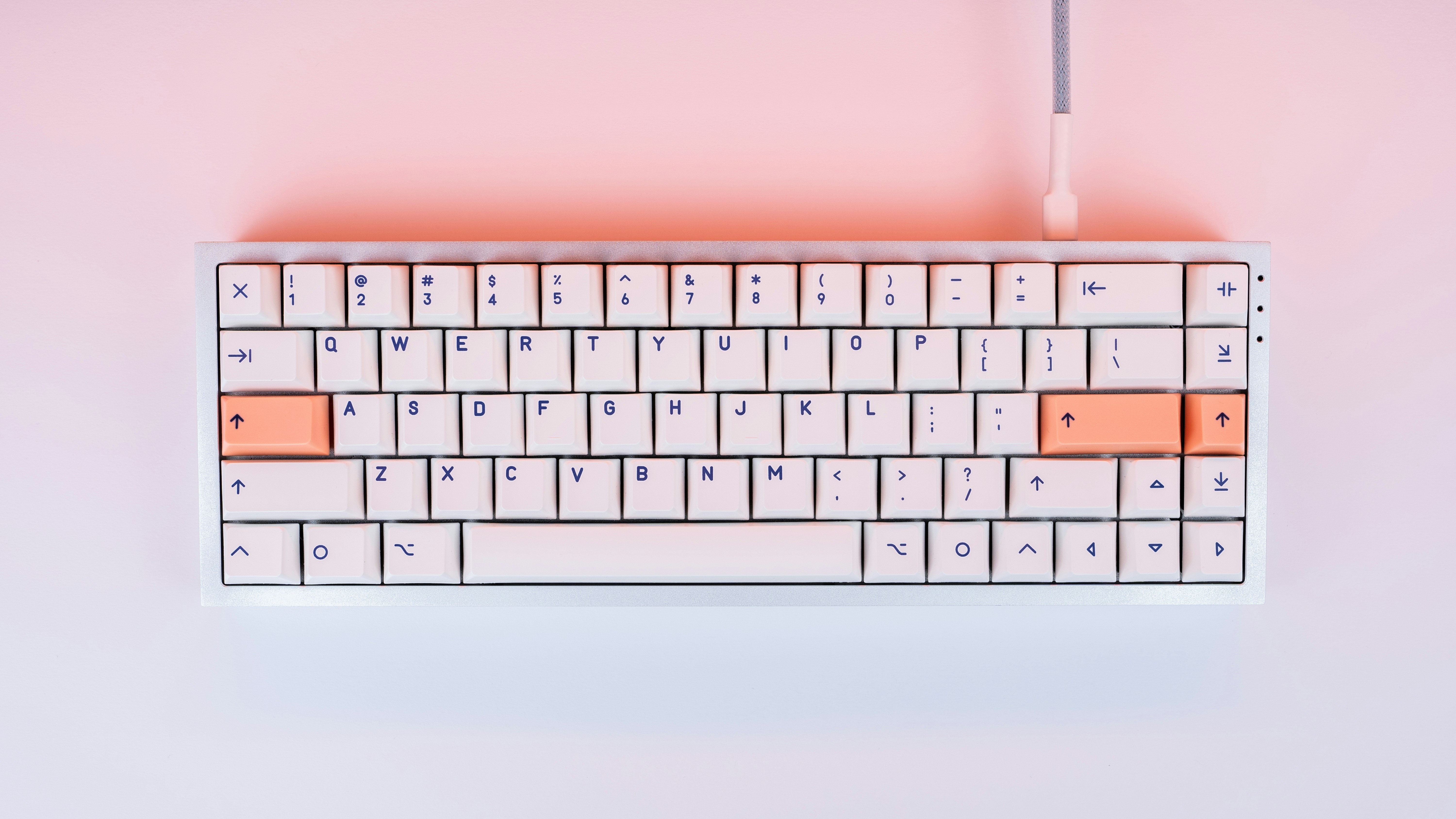 A white and orange keyboard on a pink background photo – Free Computer ...