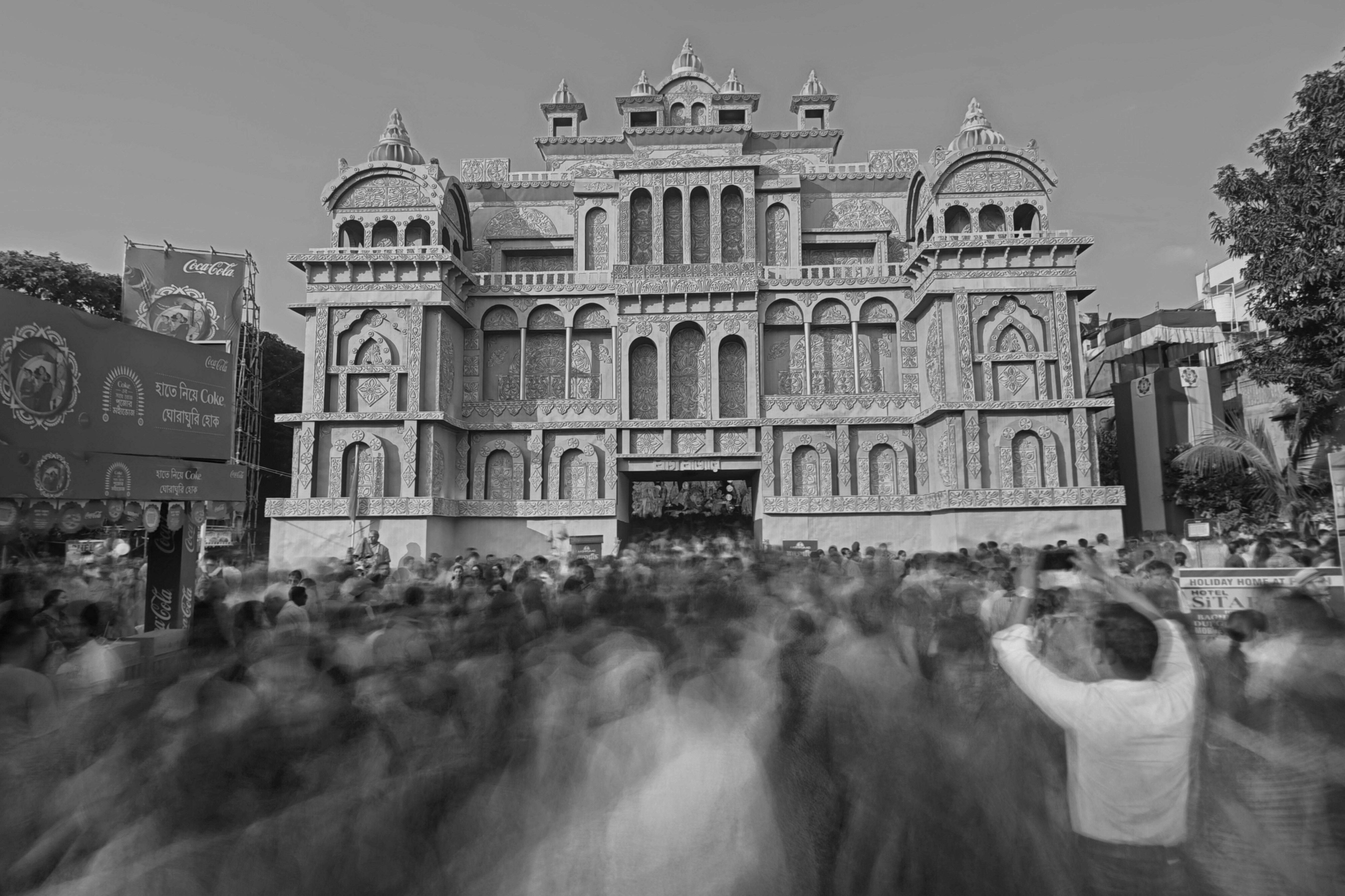 A crowd of people standing in front of a building photo – Free Grey ...