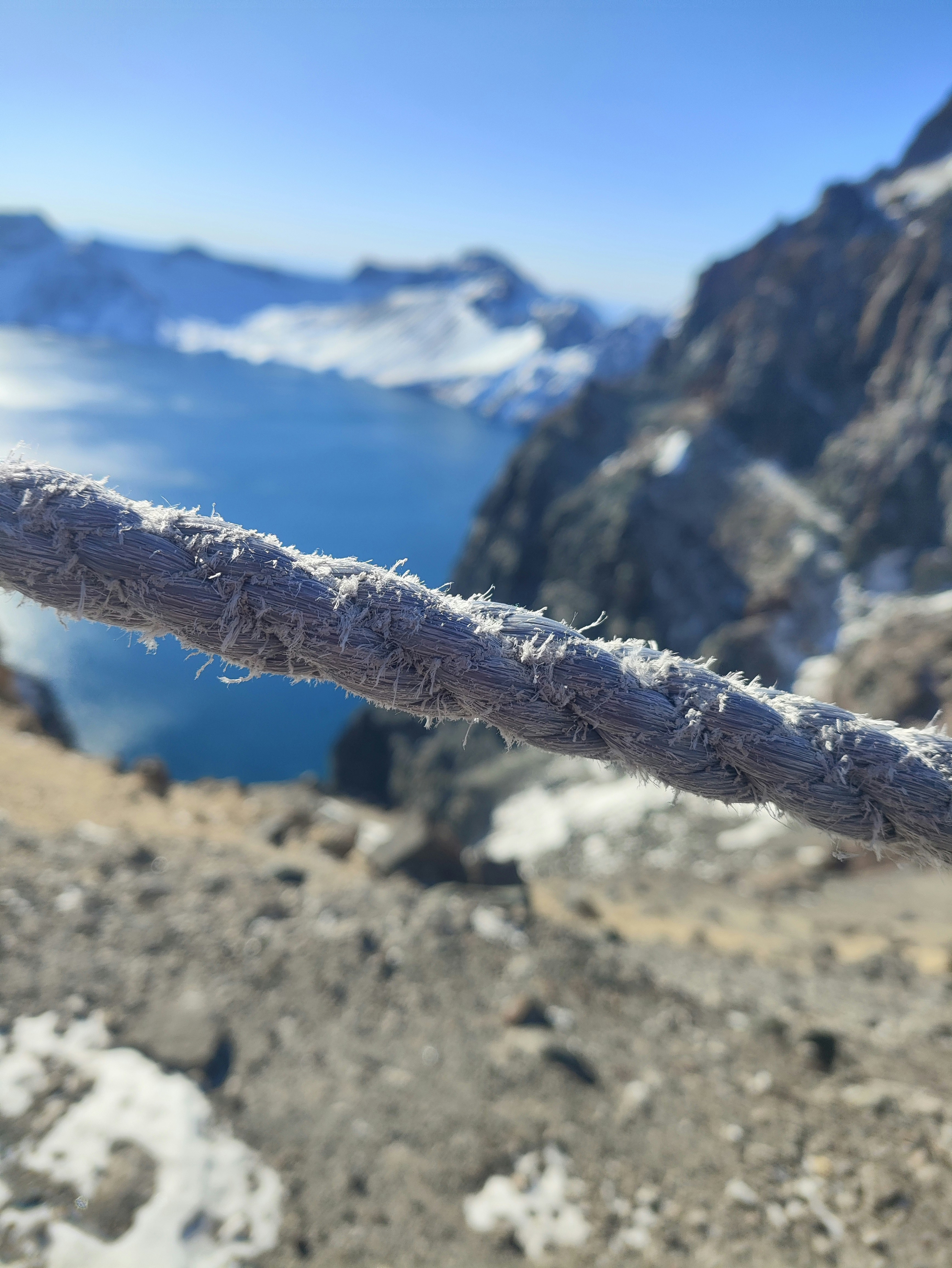 A close up of a rope with a mountain in the background photo – Free ...