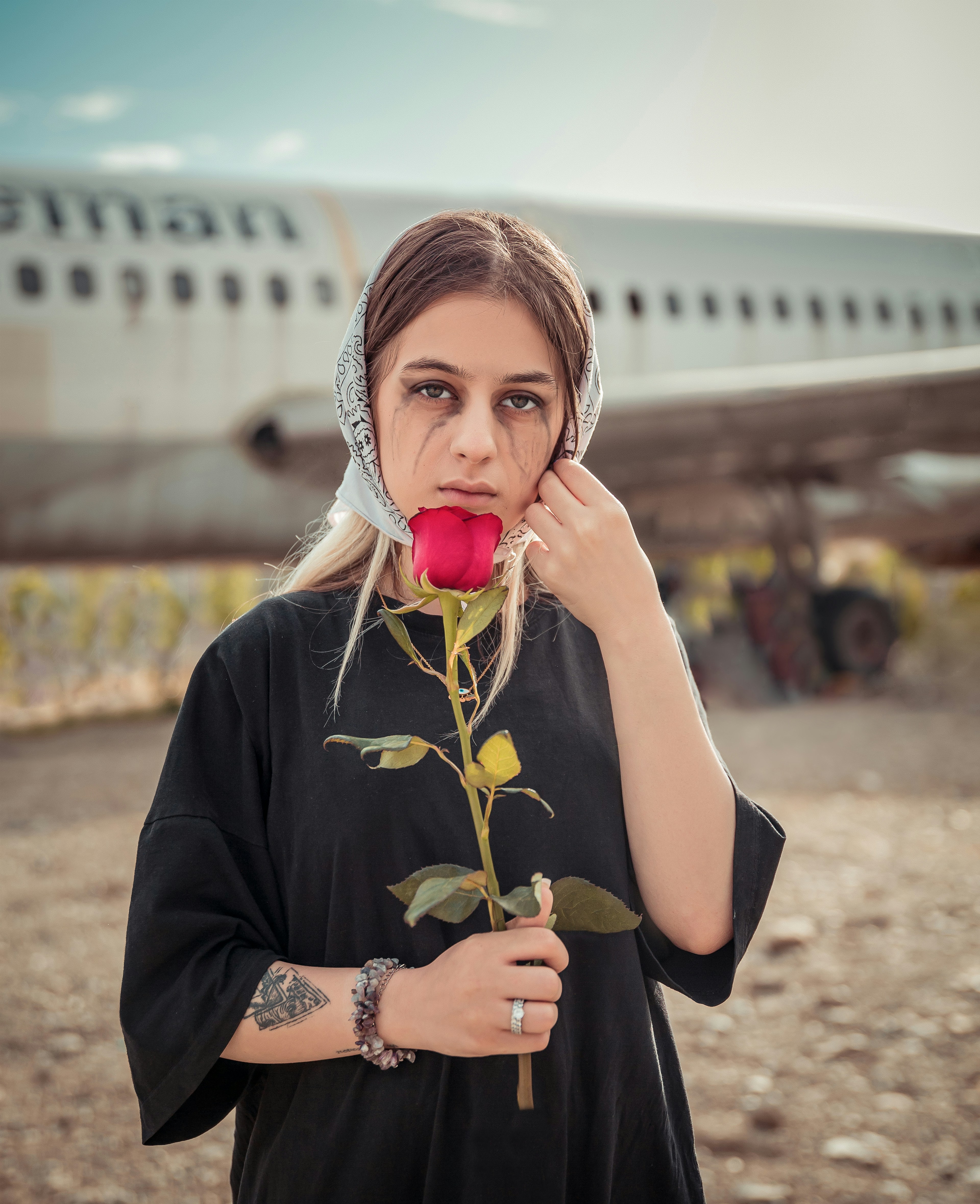 Crimson Rose, Portrait Before a Grounded Jet