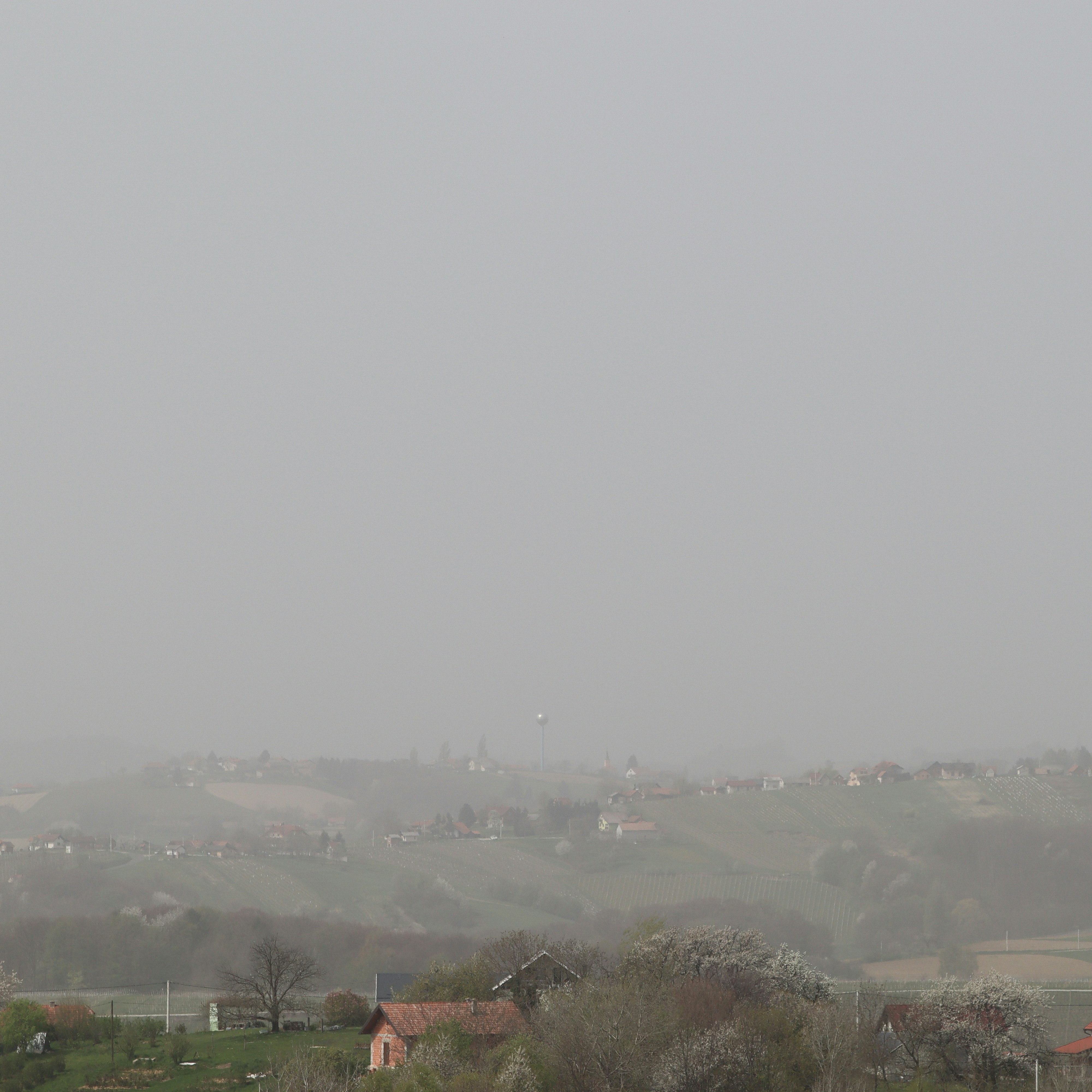 Hazy Horizon Over Rolling Countryside