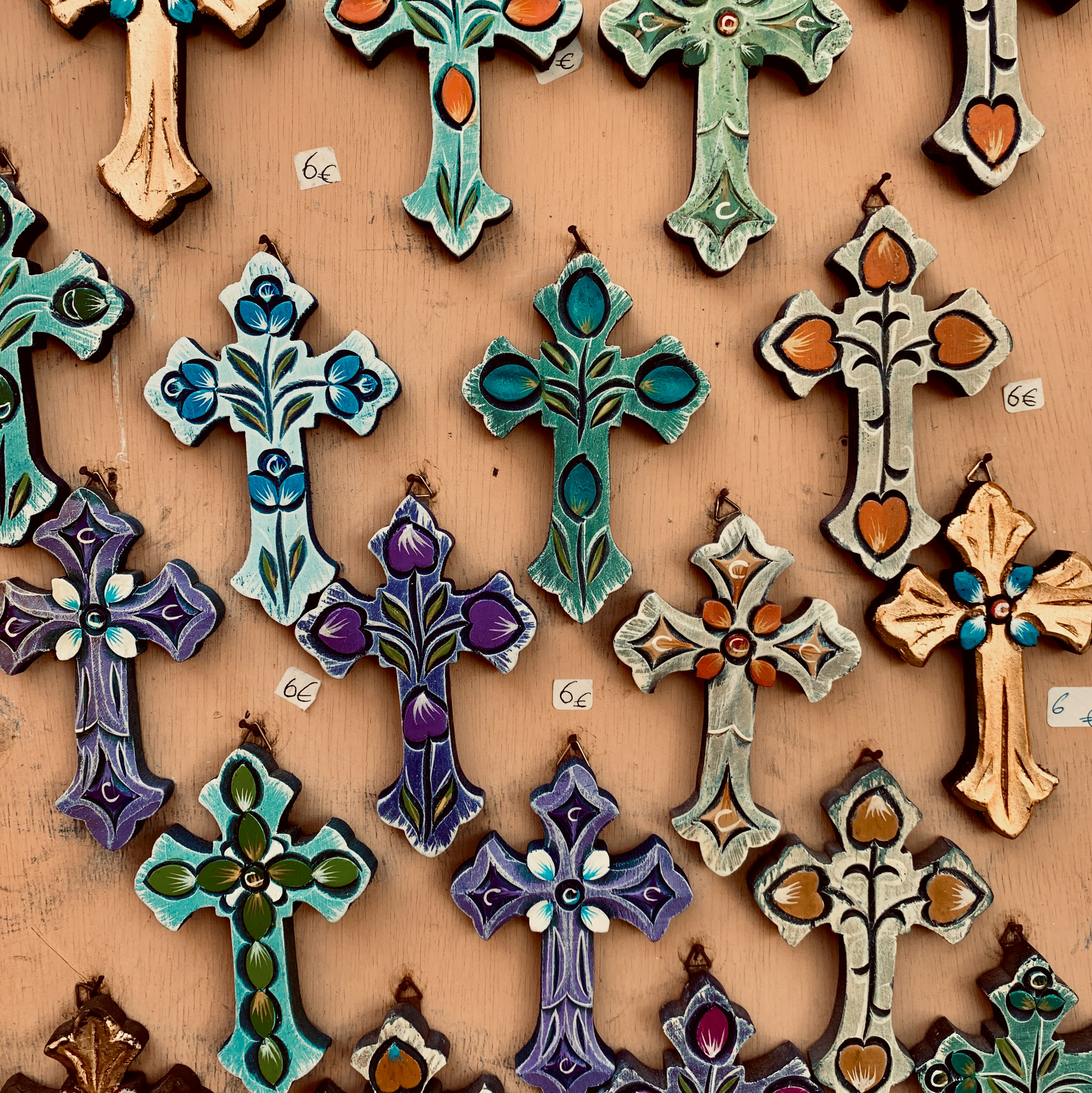 A bunch of crosses that are on a wall photo – Free Santorini Image on ...