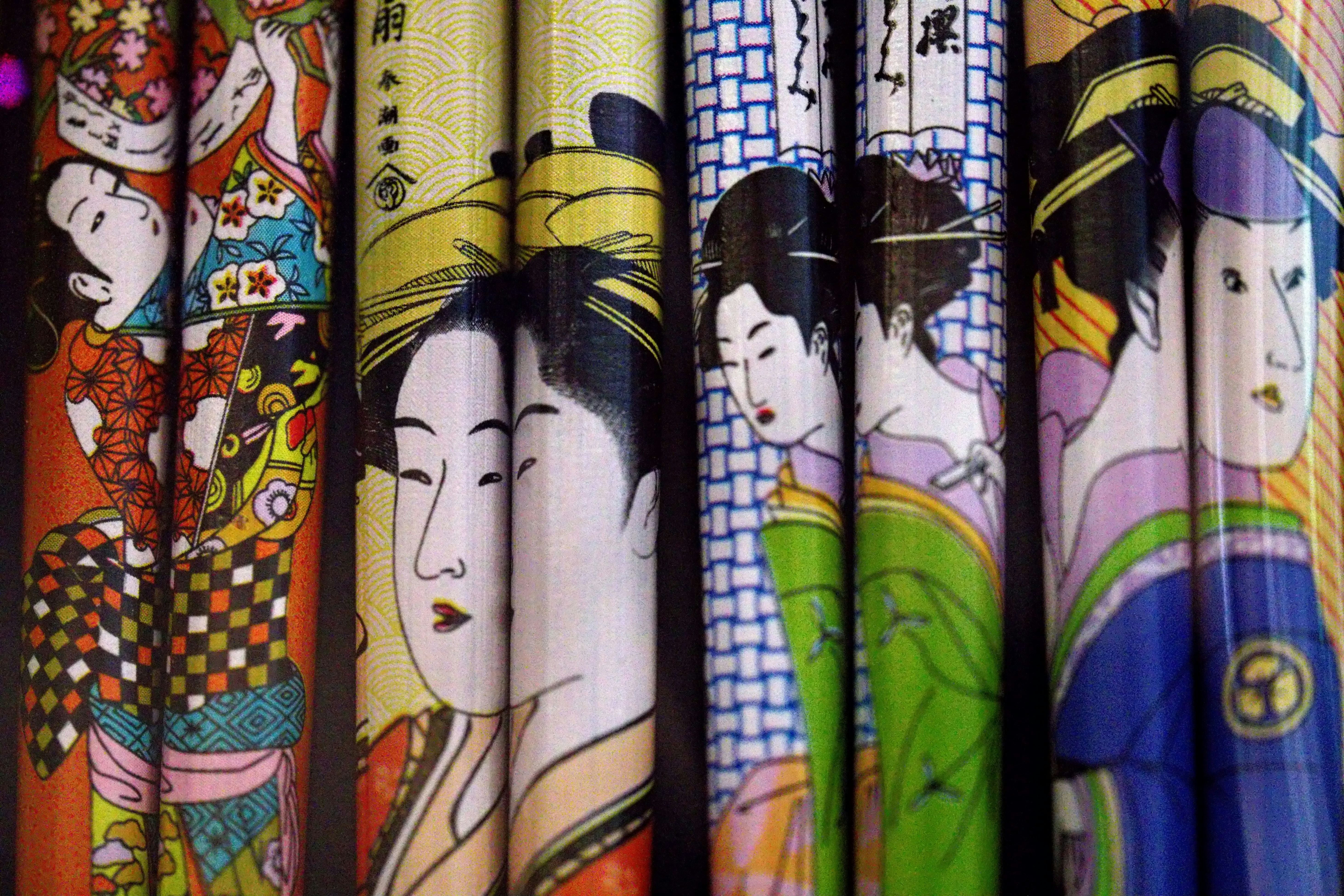 Threads of Tradition: Close-up of Painted Kimono Fabrics in a Row