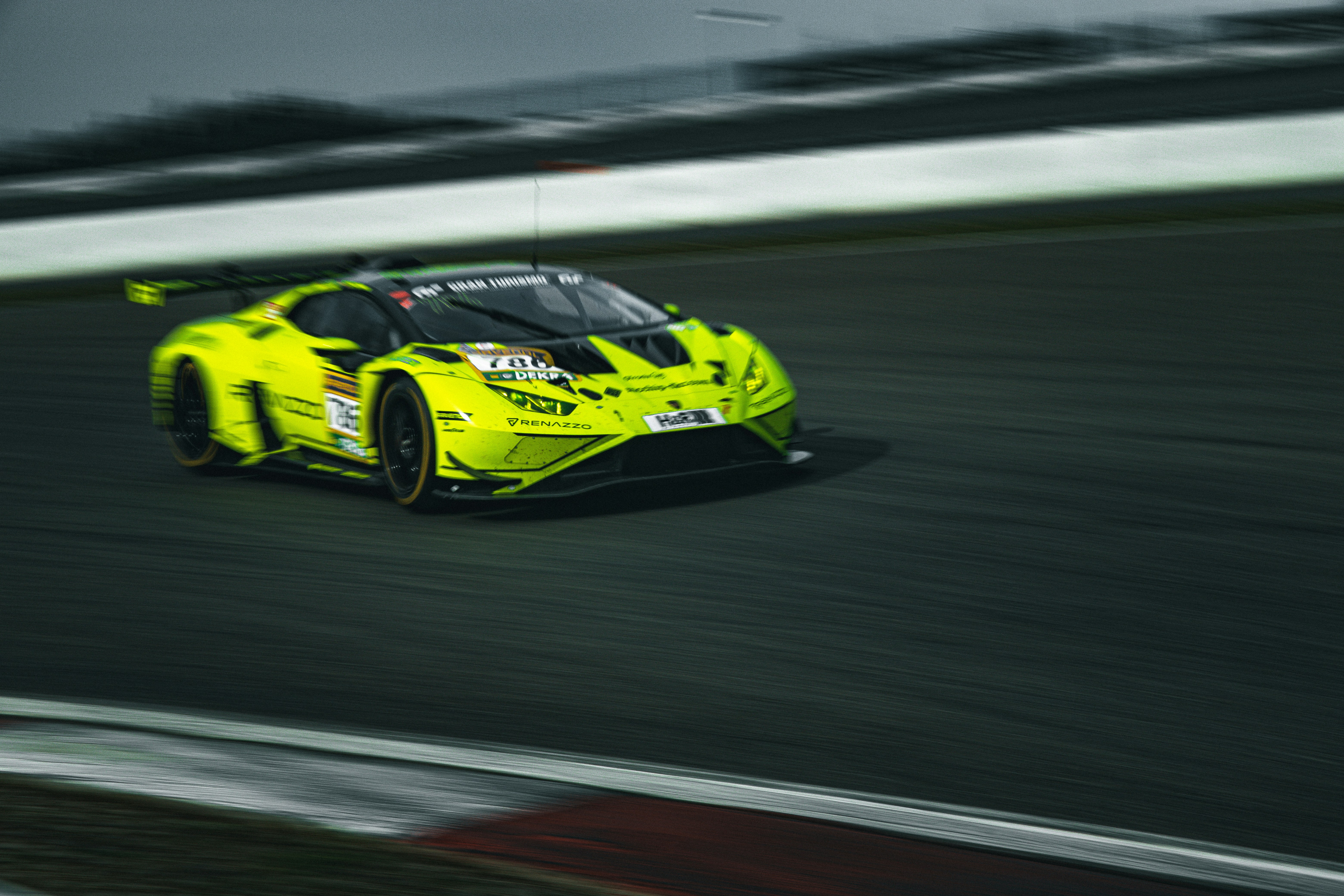 Neon Bolt on Asphalt: High-Speed Blur of a Yellow Racecar