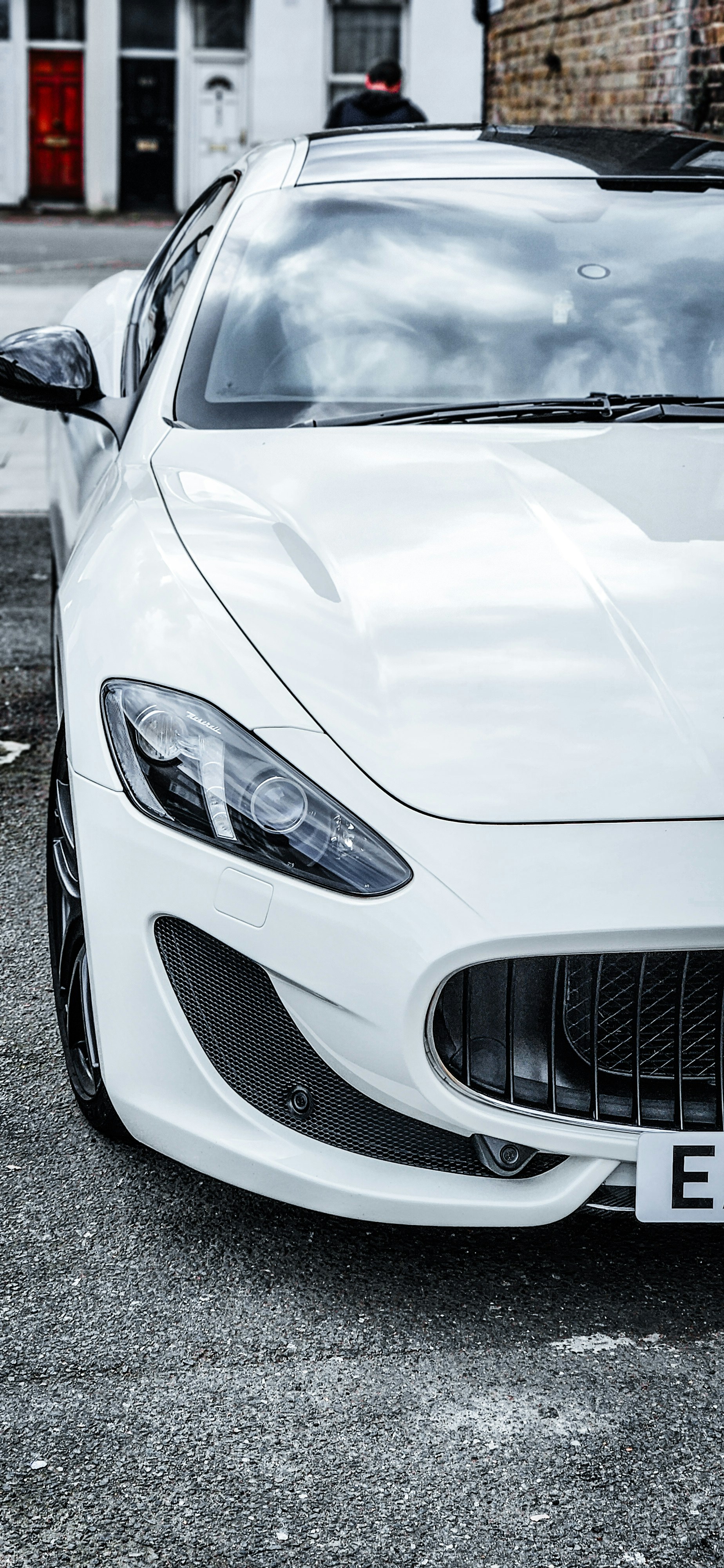 Chrome and Curves: Front-Face Portrait of a White Performance Car