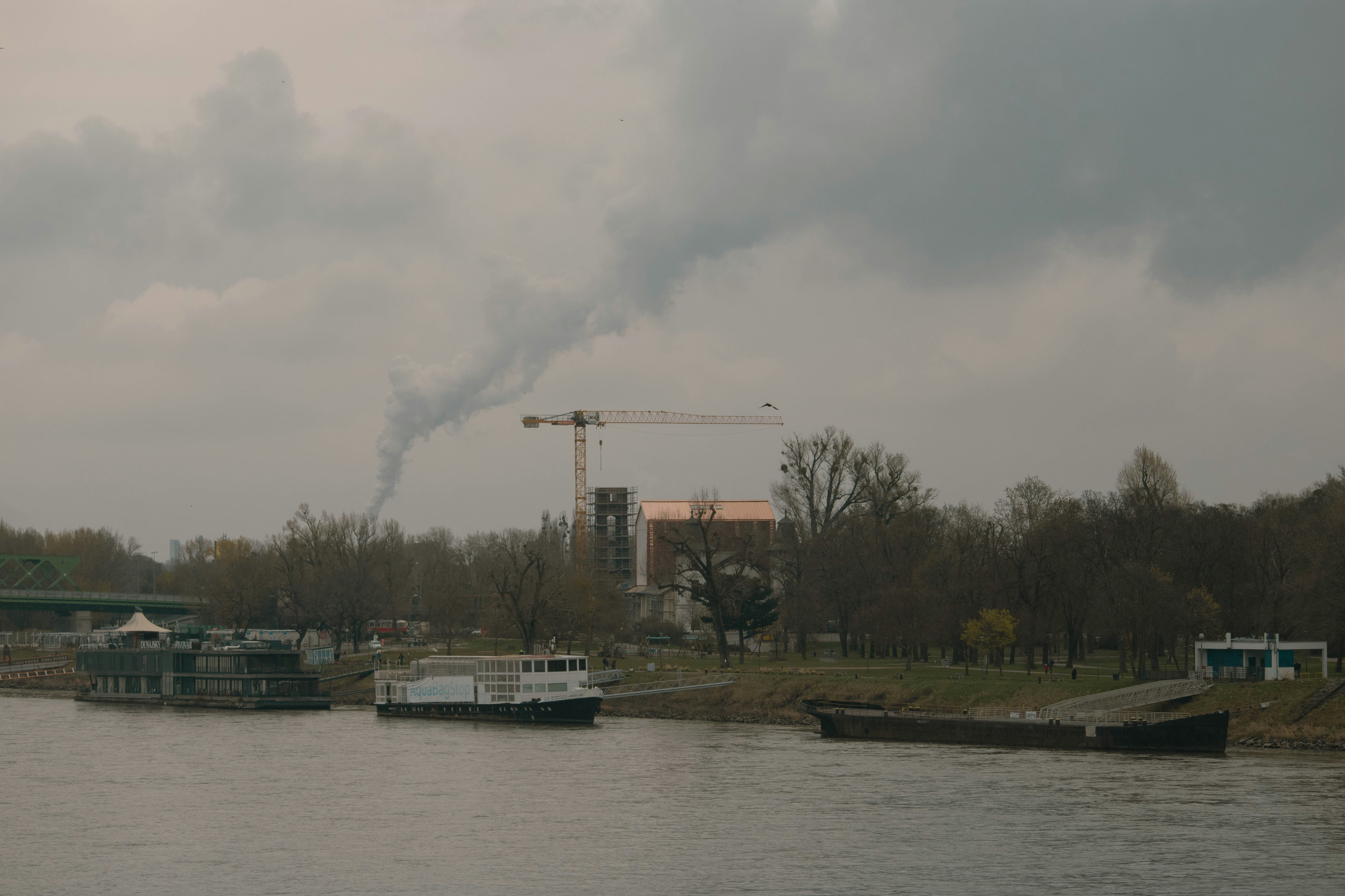 Industrial Quiet: Crane and Smoke Over the River