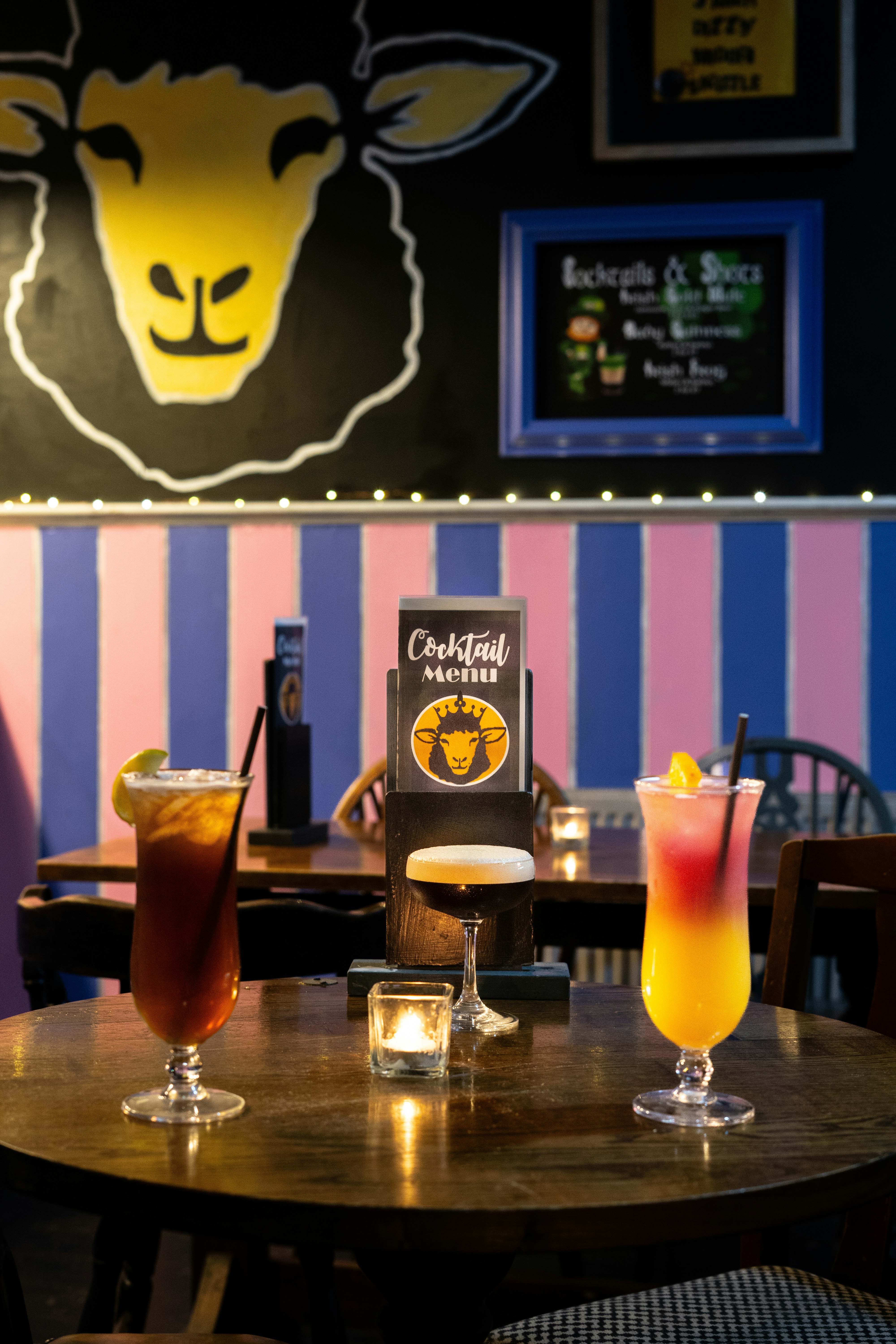 A table topped with two drinks next to a menu photo – Free Music Image ...