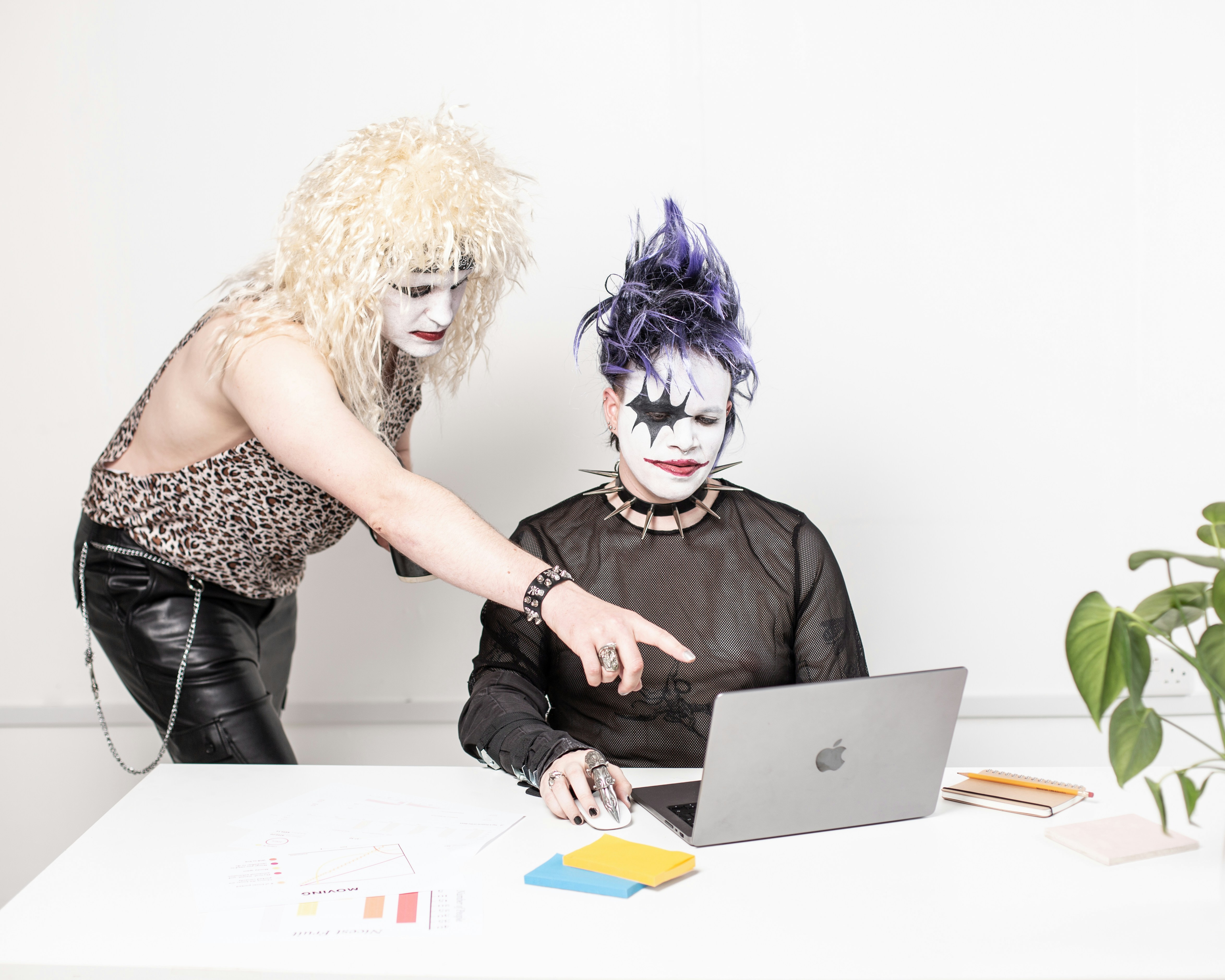 Two people dressed up as clowns working on a laptop photo – Free ...