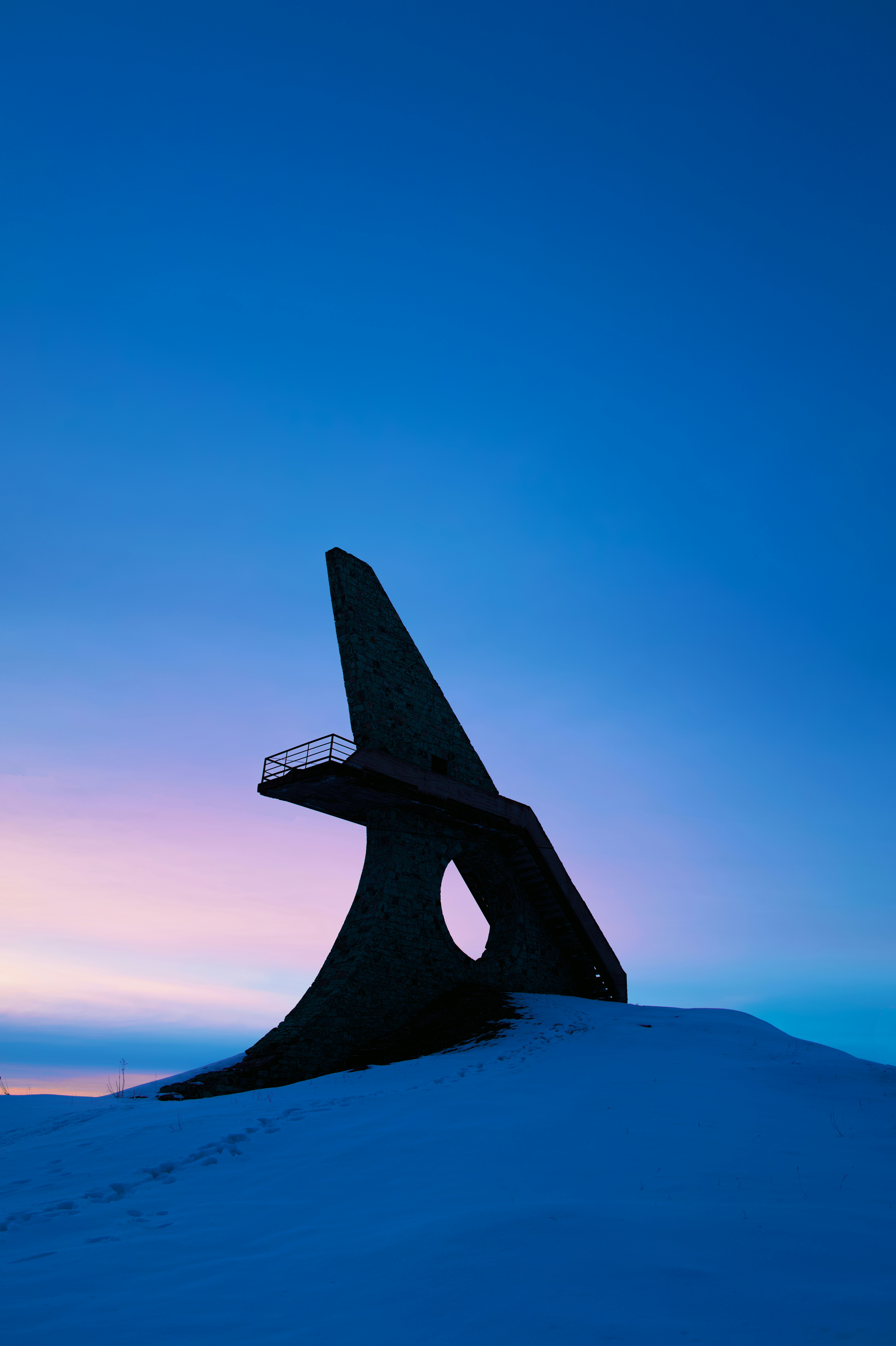 Arc of Silence: Snowbound Monument under a Blue Hour Sky