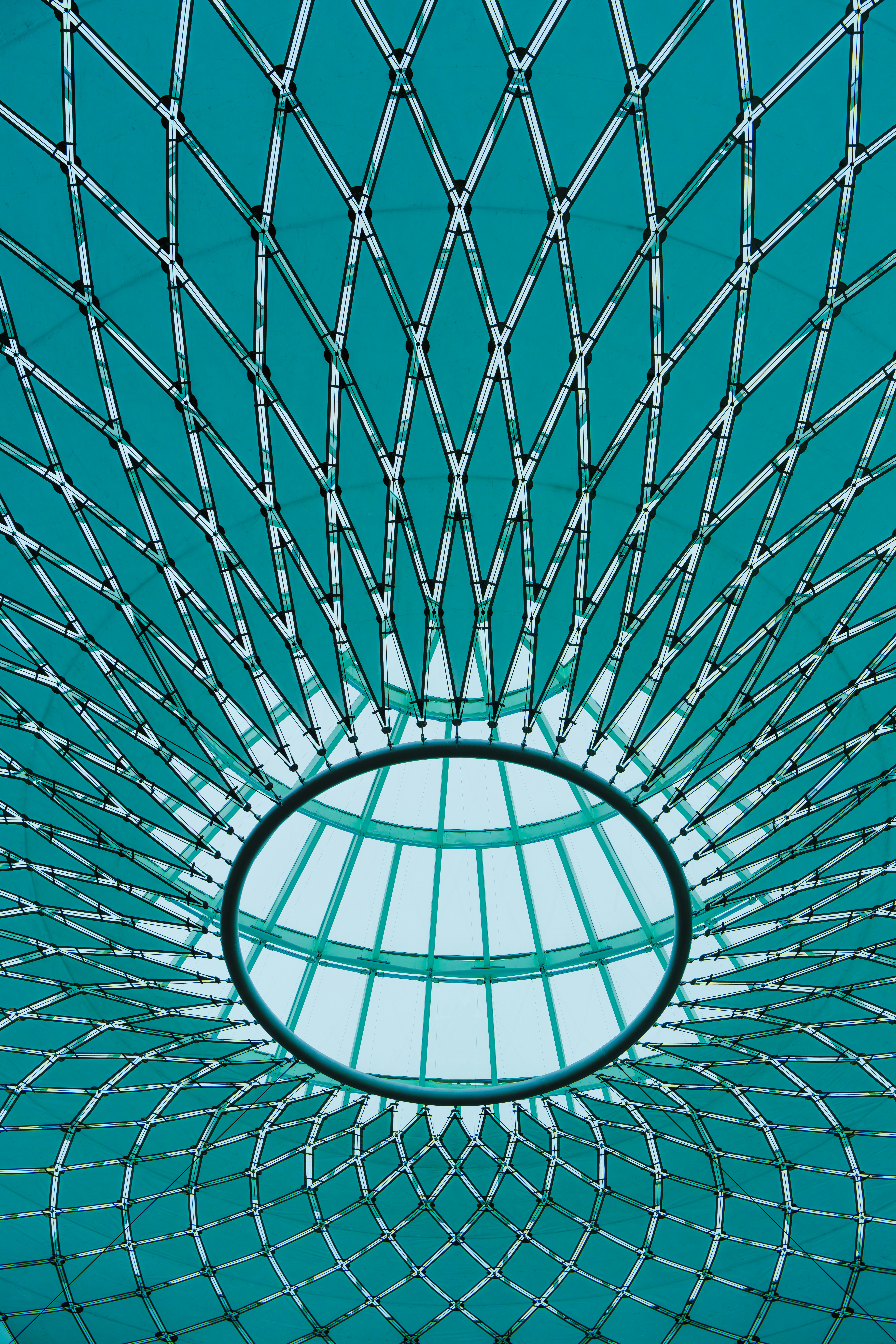 A circular metal structure with a blue sky in the background photo ...